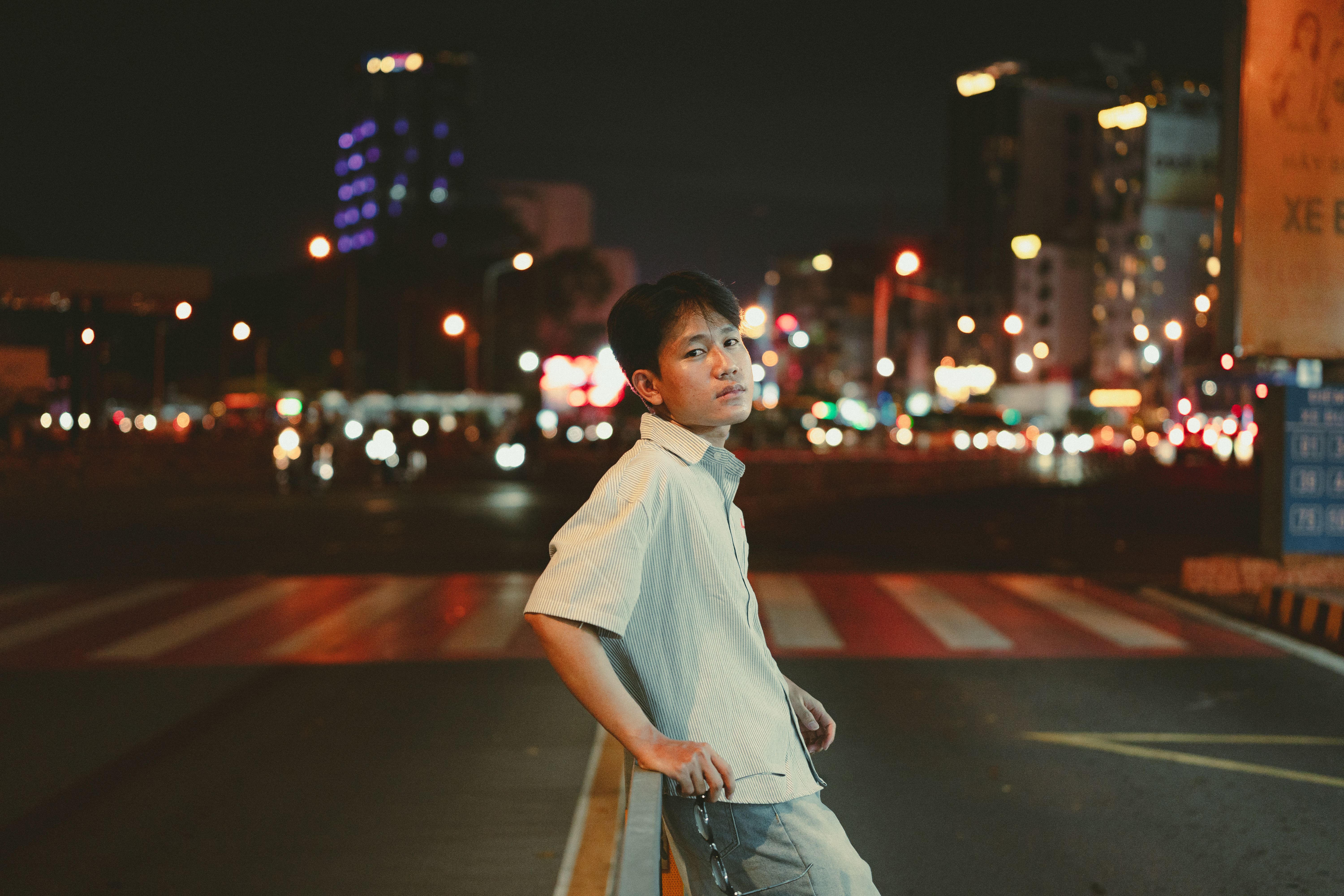 Fashionable Woman Posing by Urban Stop Sign at Night · Free Stock Photo