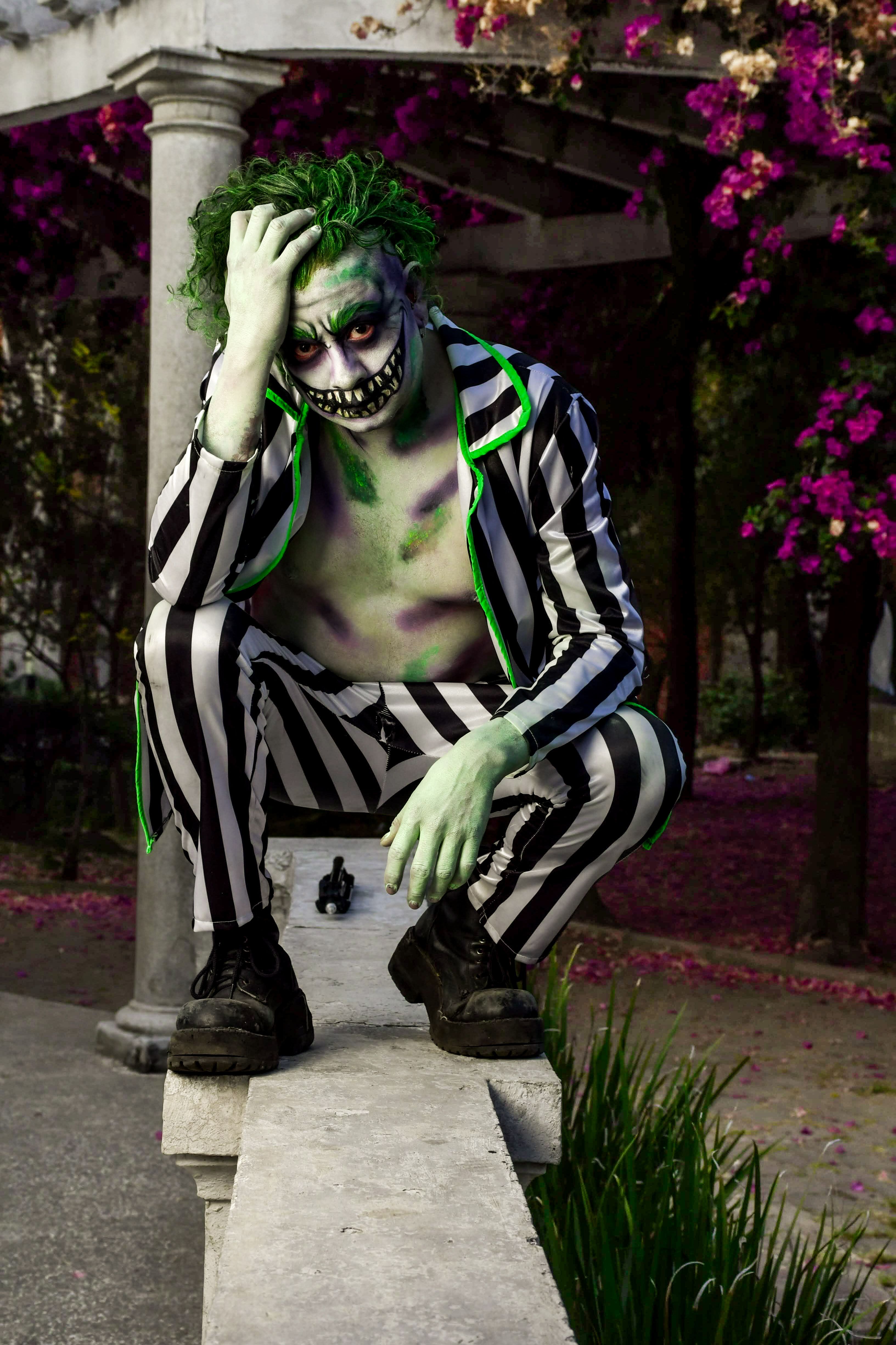 Green Zombie in Striped Suit in Garden · Free Stock Photo