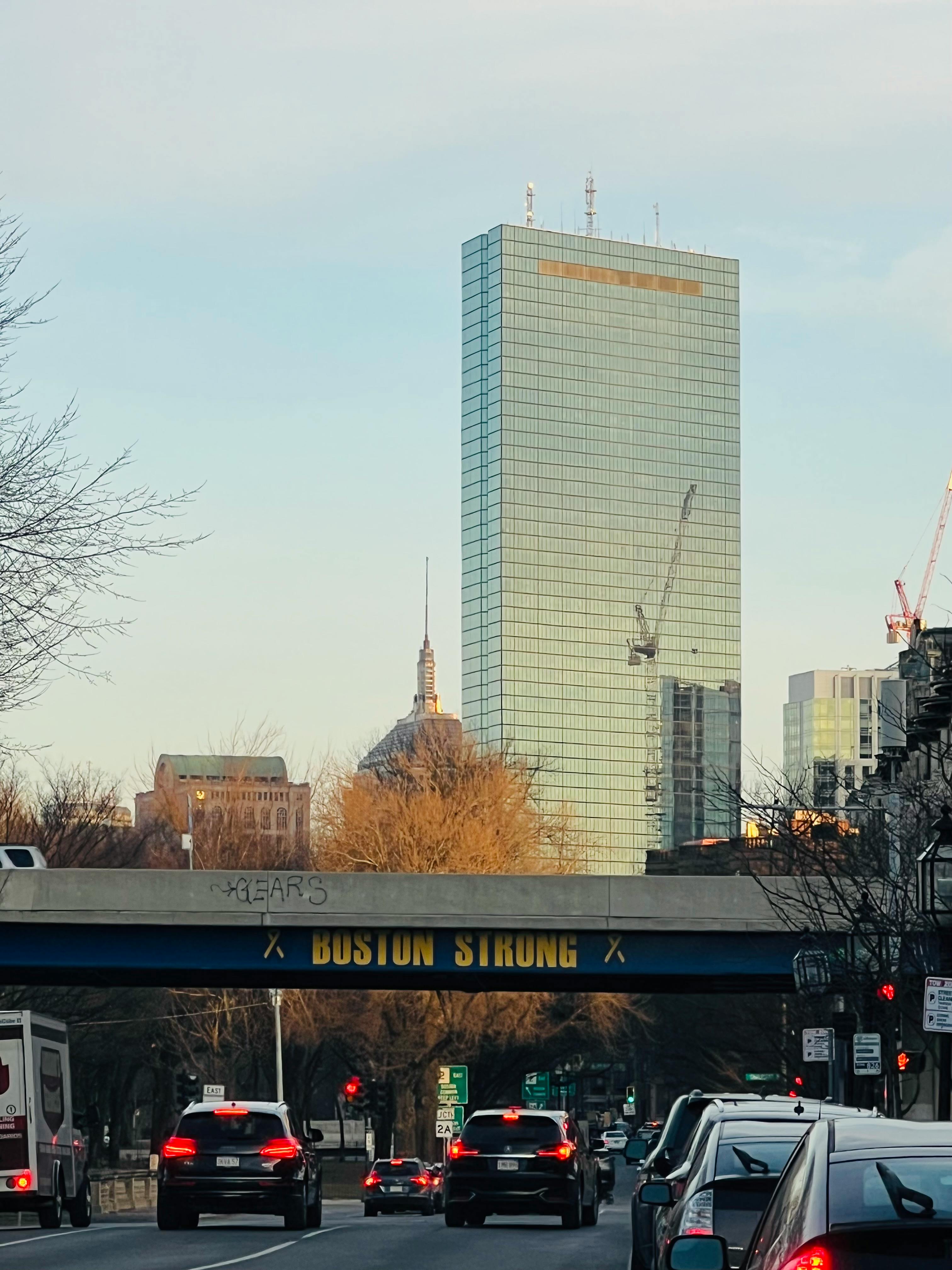 Boston Strong Signage Under Downtown Skyline · Free Stock Photo