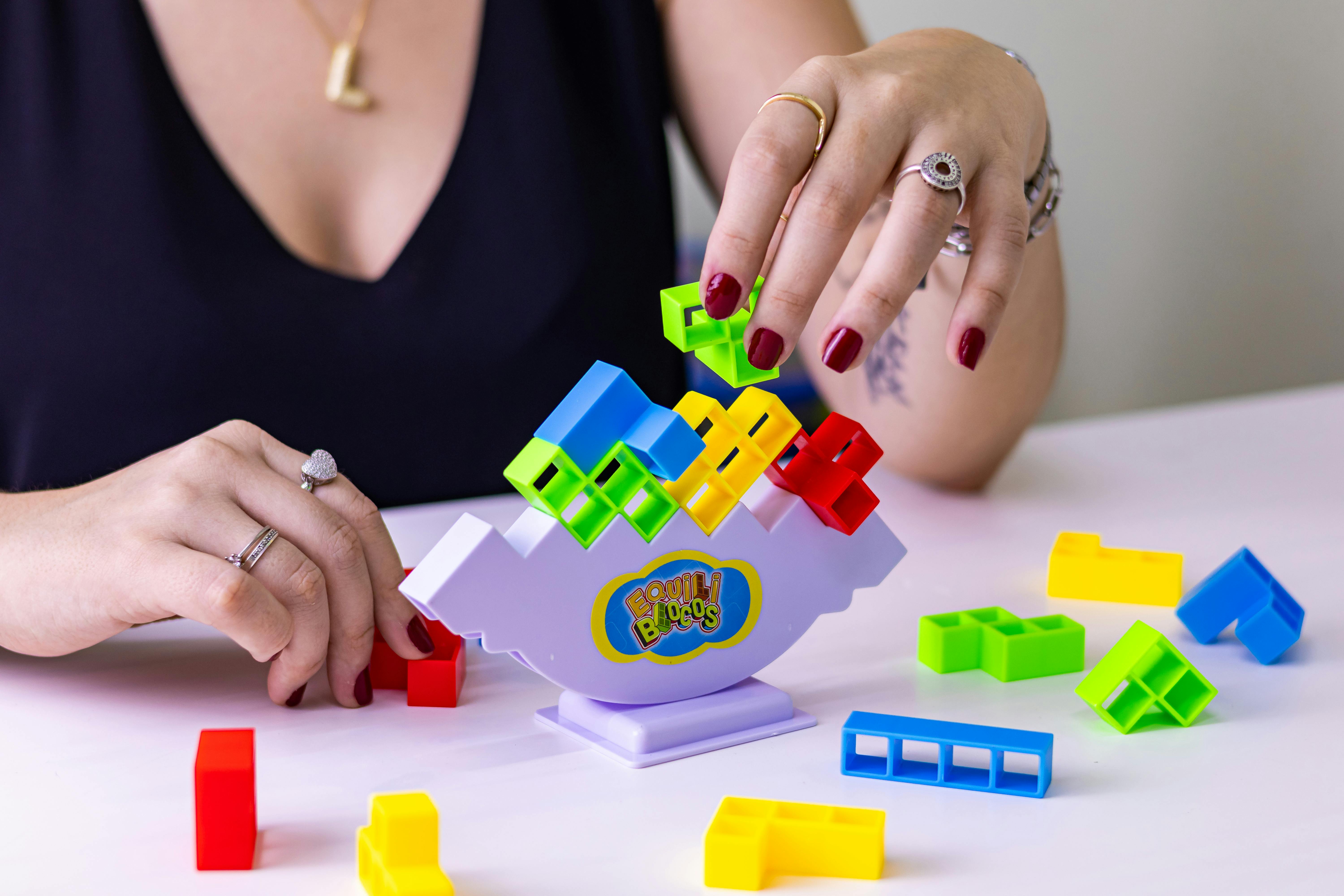 Colorful Block Balancing Game on Table · Free Stock Photo