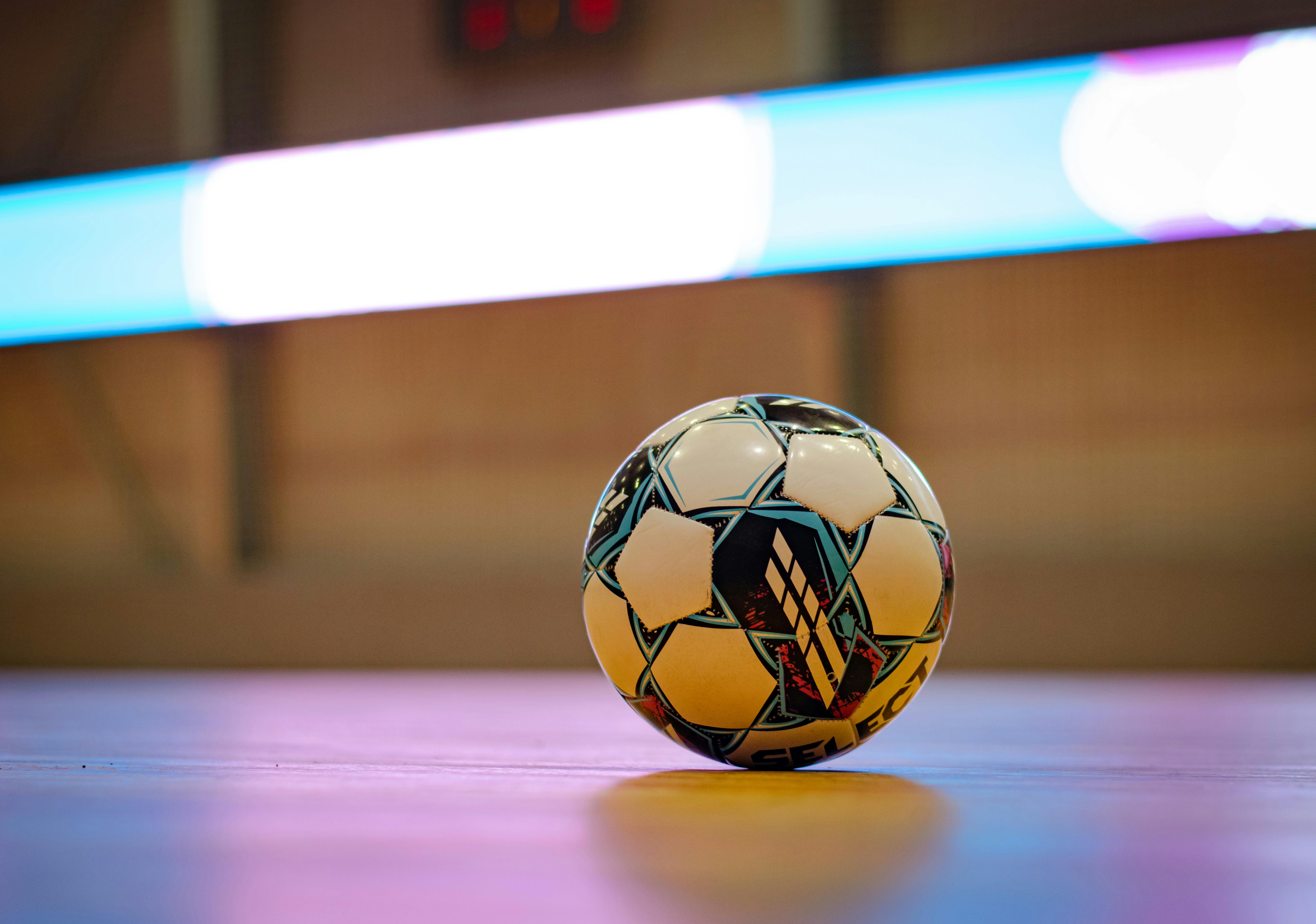 Indoor Soccer Ball on Glossy Floor · Free Stock Photo