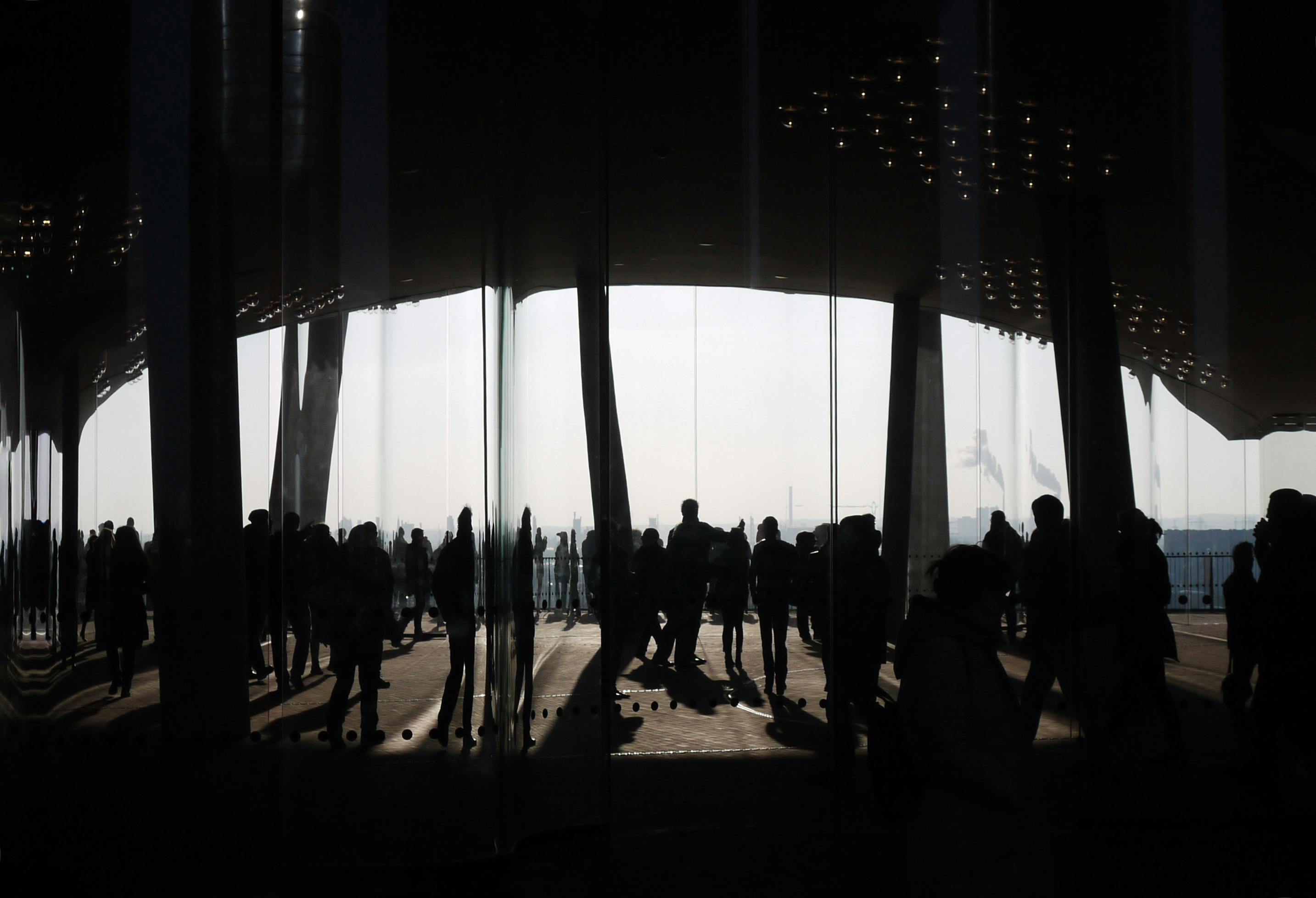 Silhouetted People in Modern Architectural Reflection · Free Stock Photo