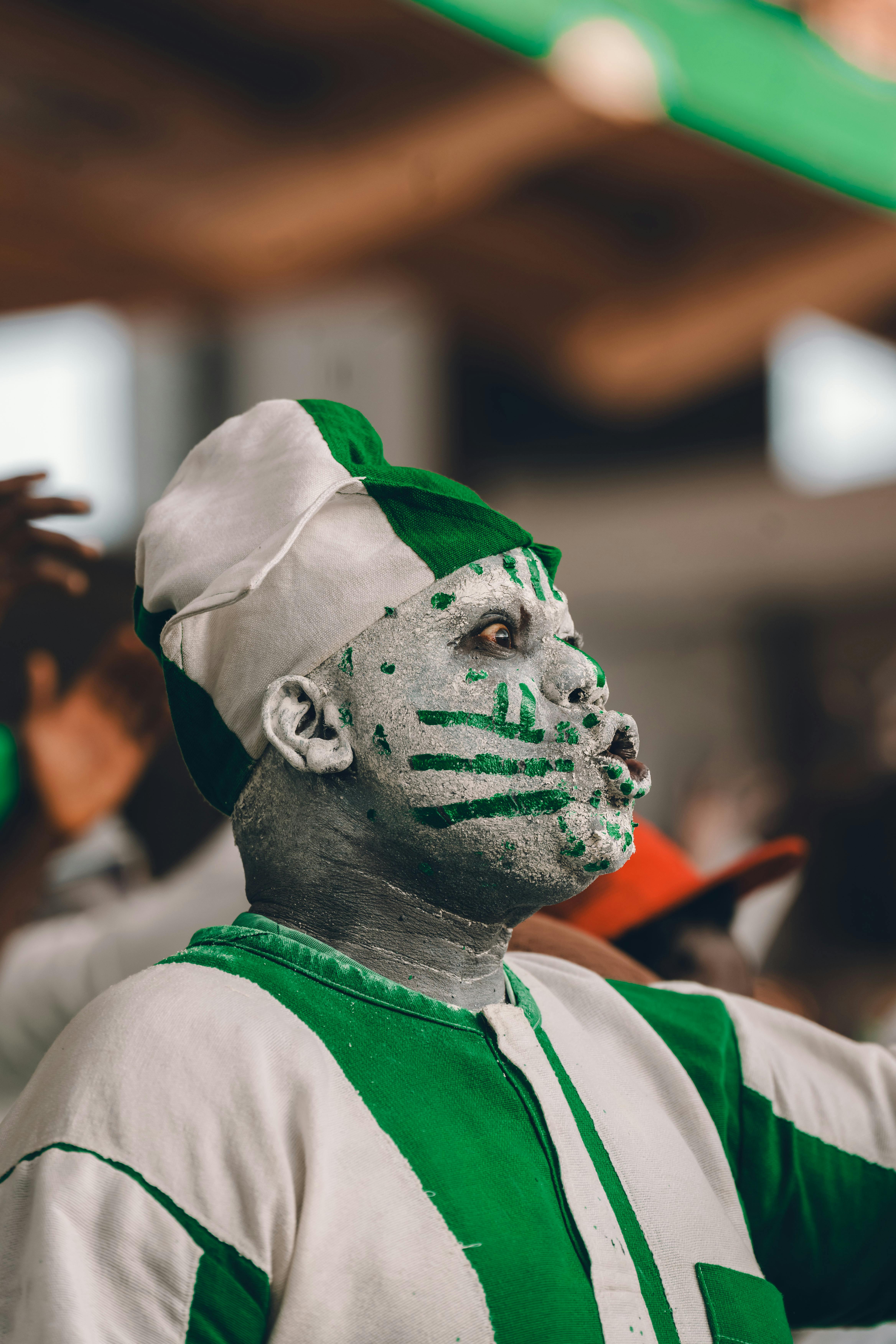 Nigerian Fan with Face Paint Celebrating · Free Stock Photo