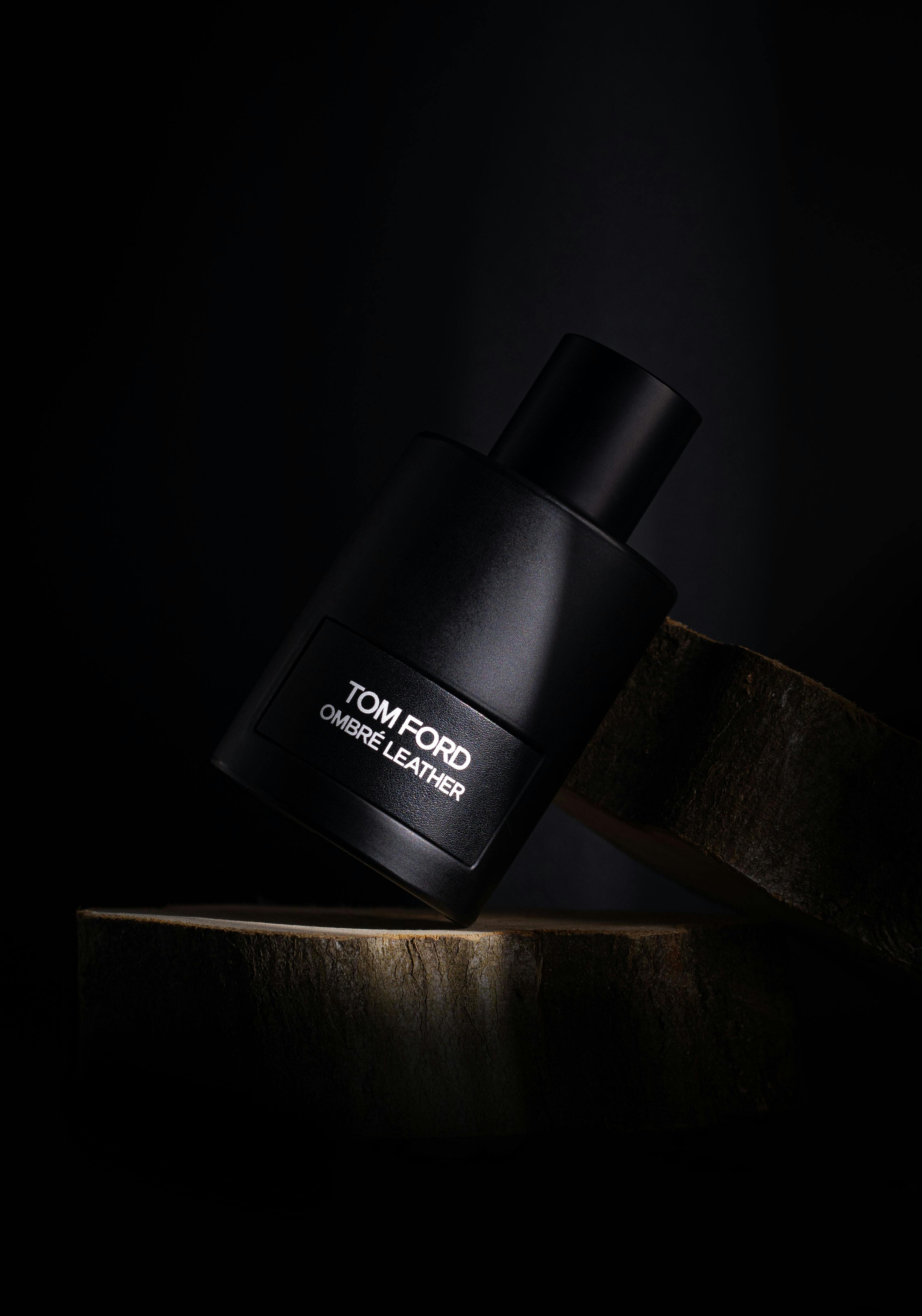 Elegant Black Perfume Bottle on a Dark Background · Free Stock Photo