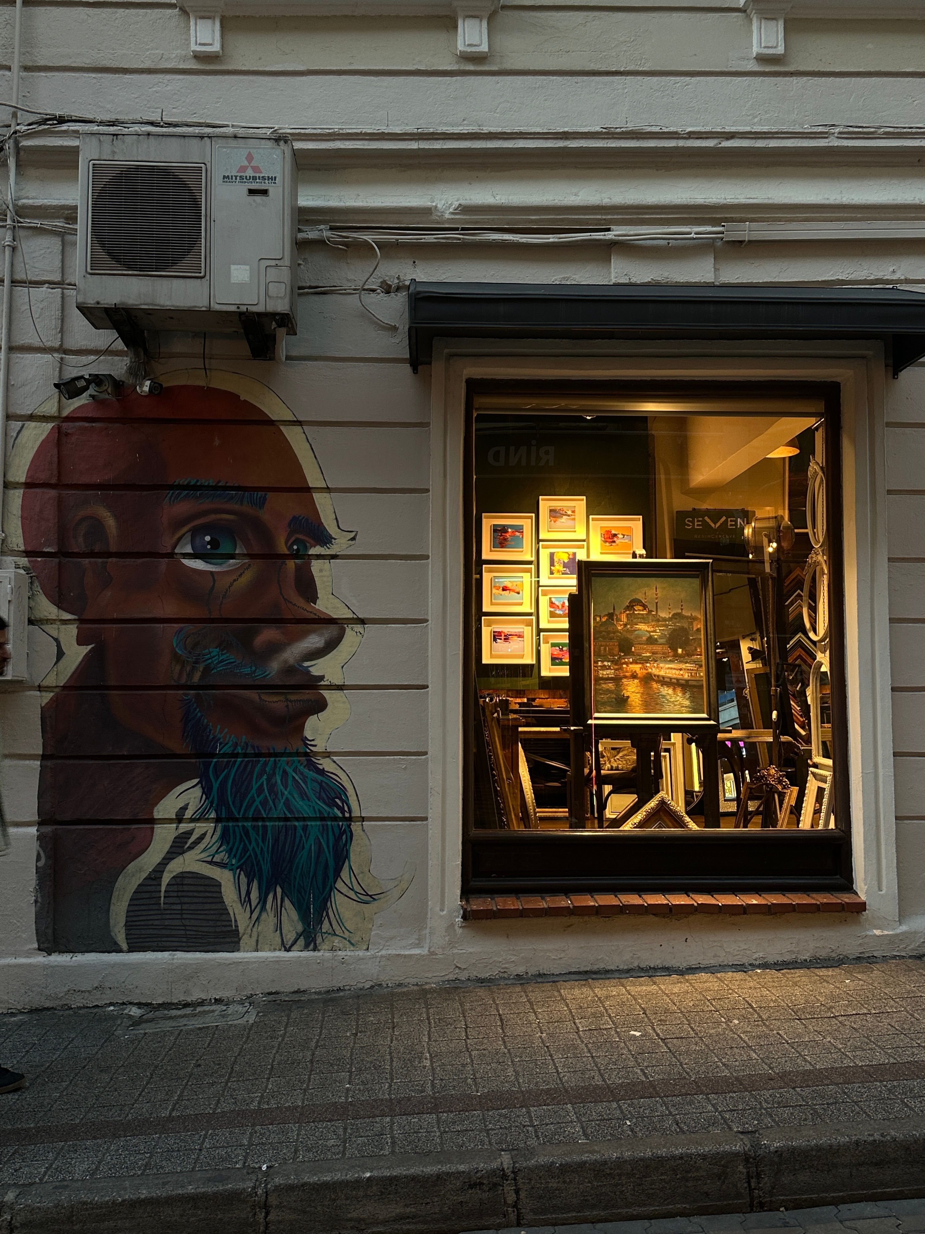 Street Art Portrait and Gallery Display at Dusk · Free Stock Photo