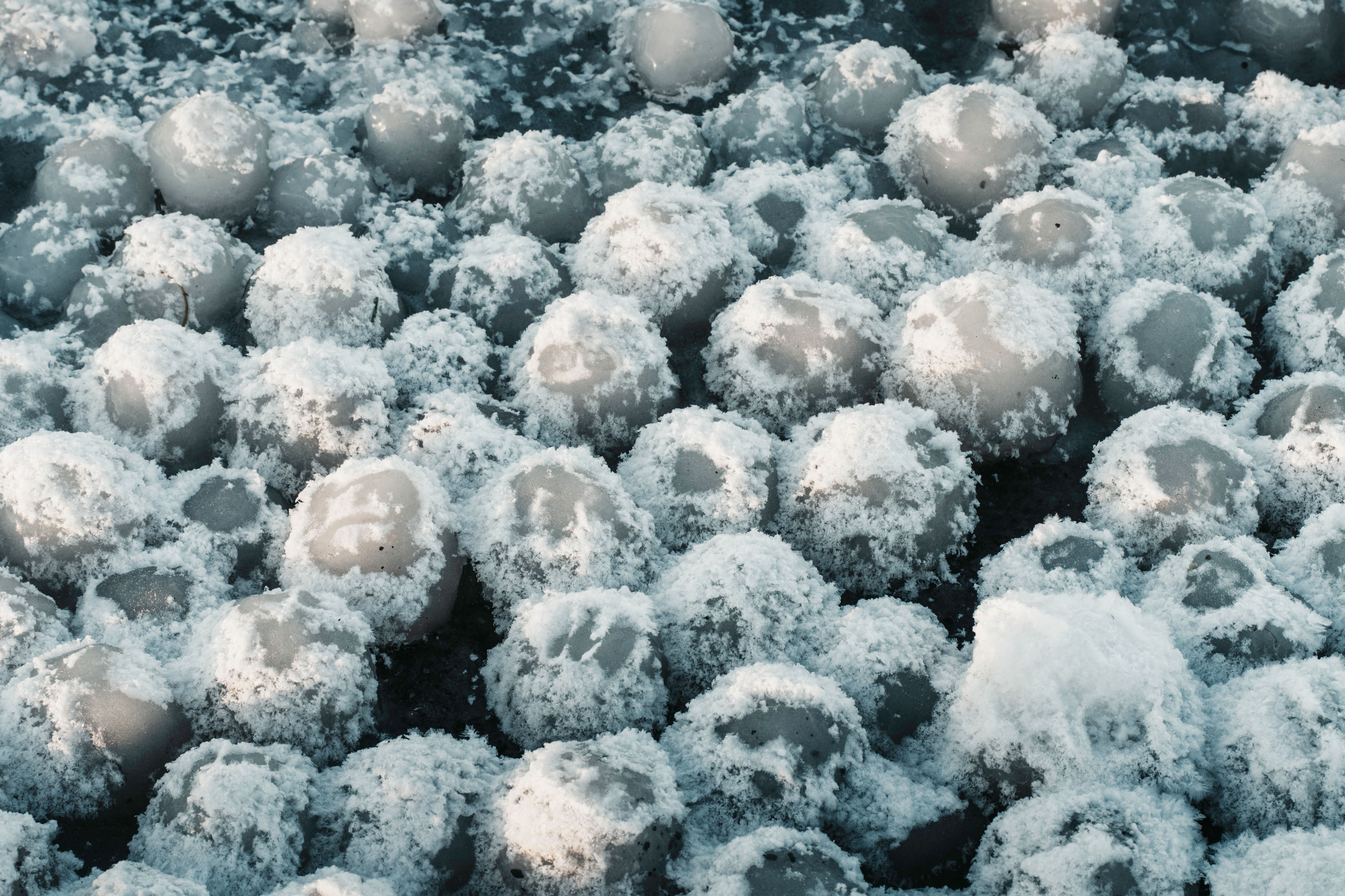 Close-up of Snow-Covered Ice Spheres on Lake · Free Stock Photo