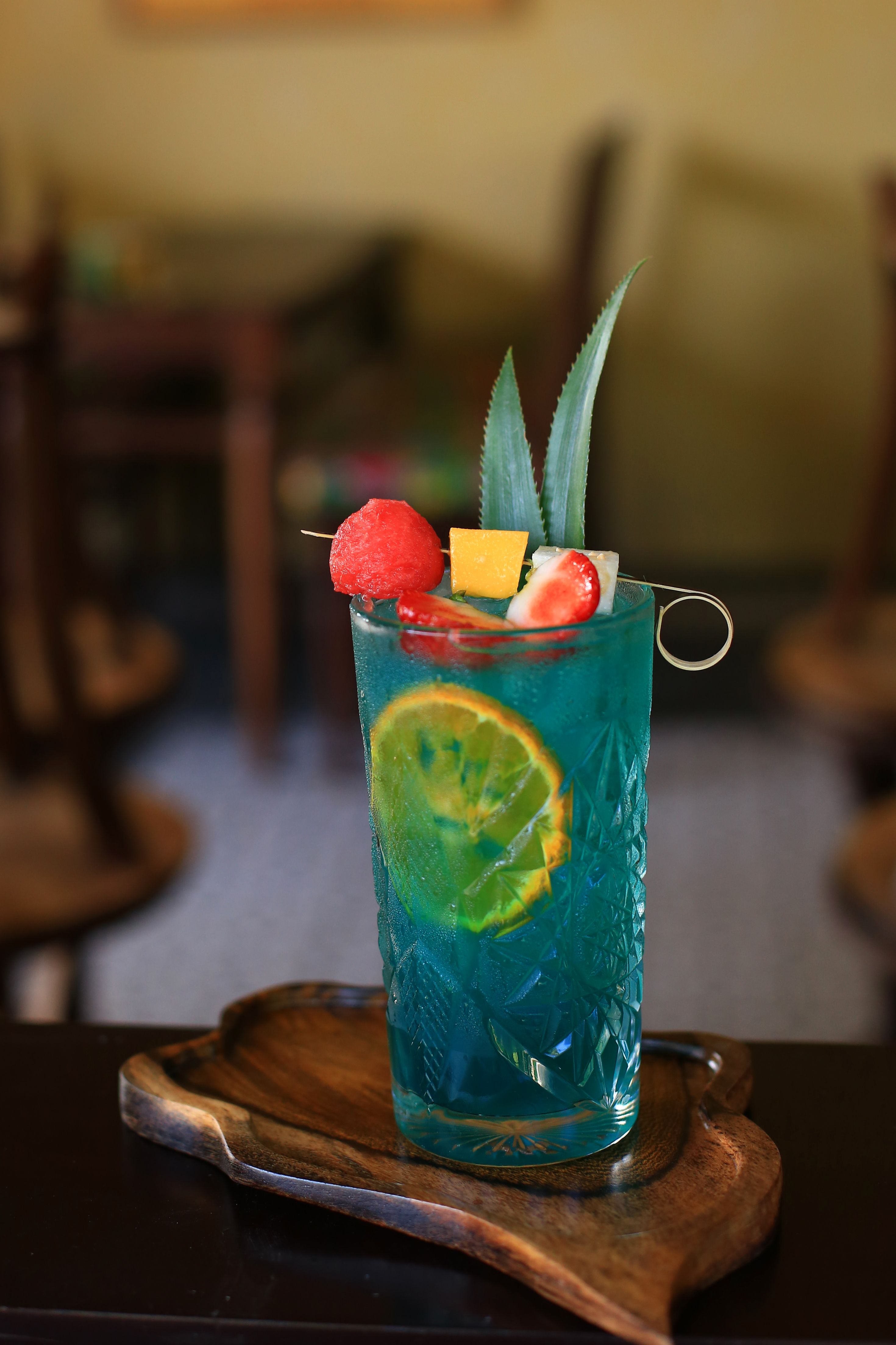 Chilled Green Cocktail with Fruit Garnish · Free Stock Photo