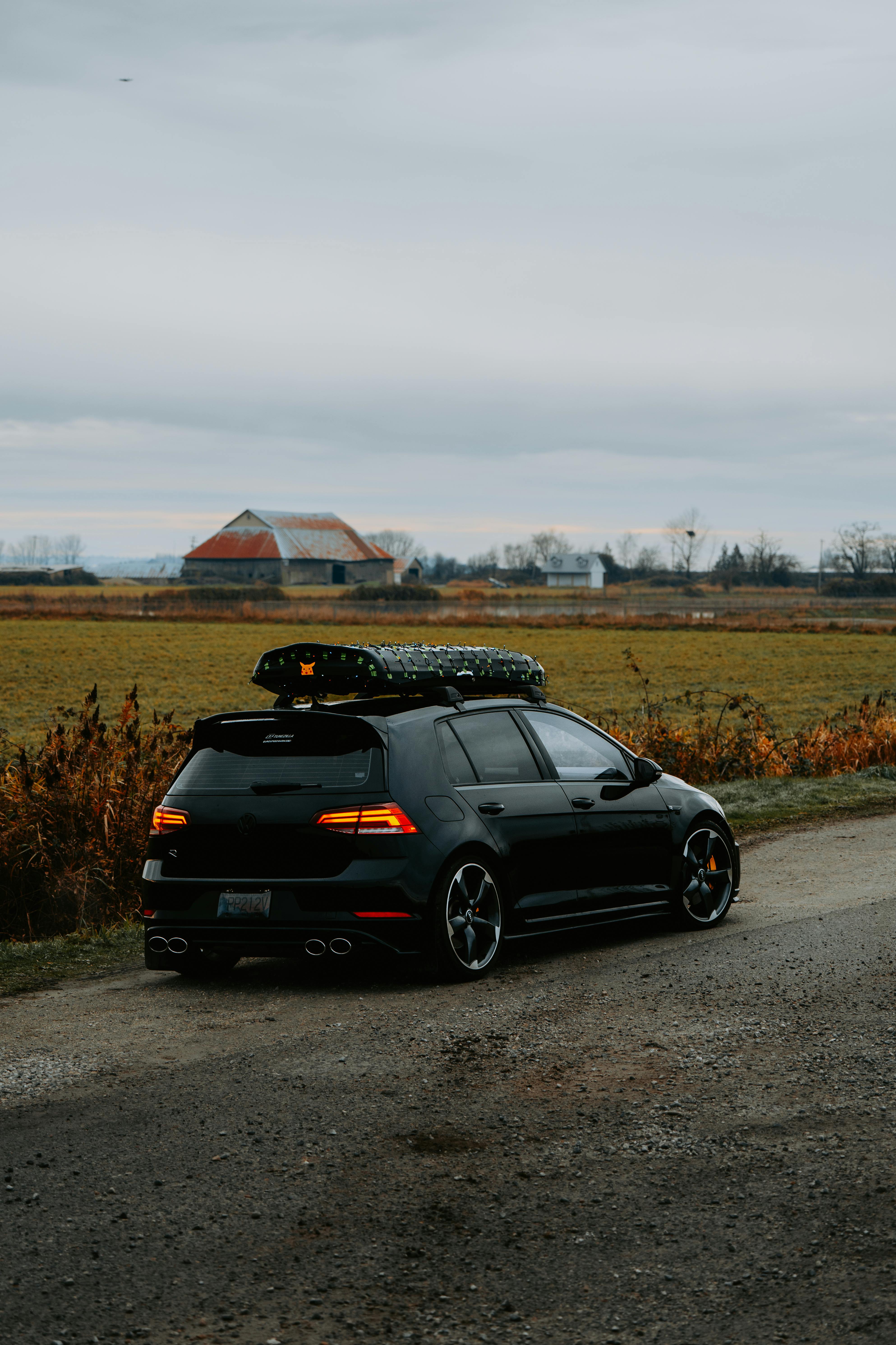 Stylish Car in Rural Countryside Setting · Free Stock Photo