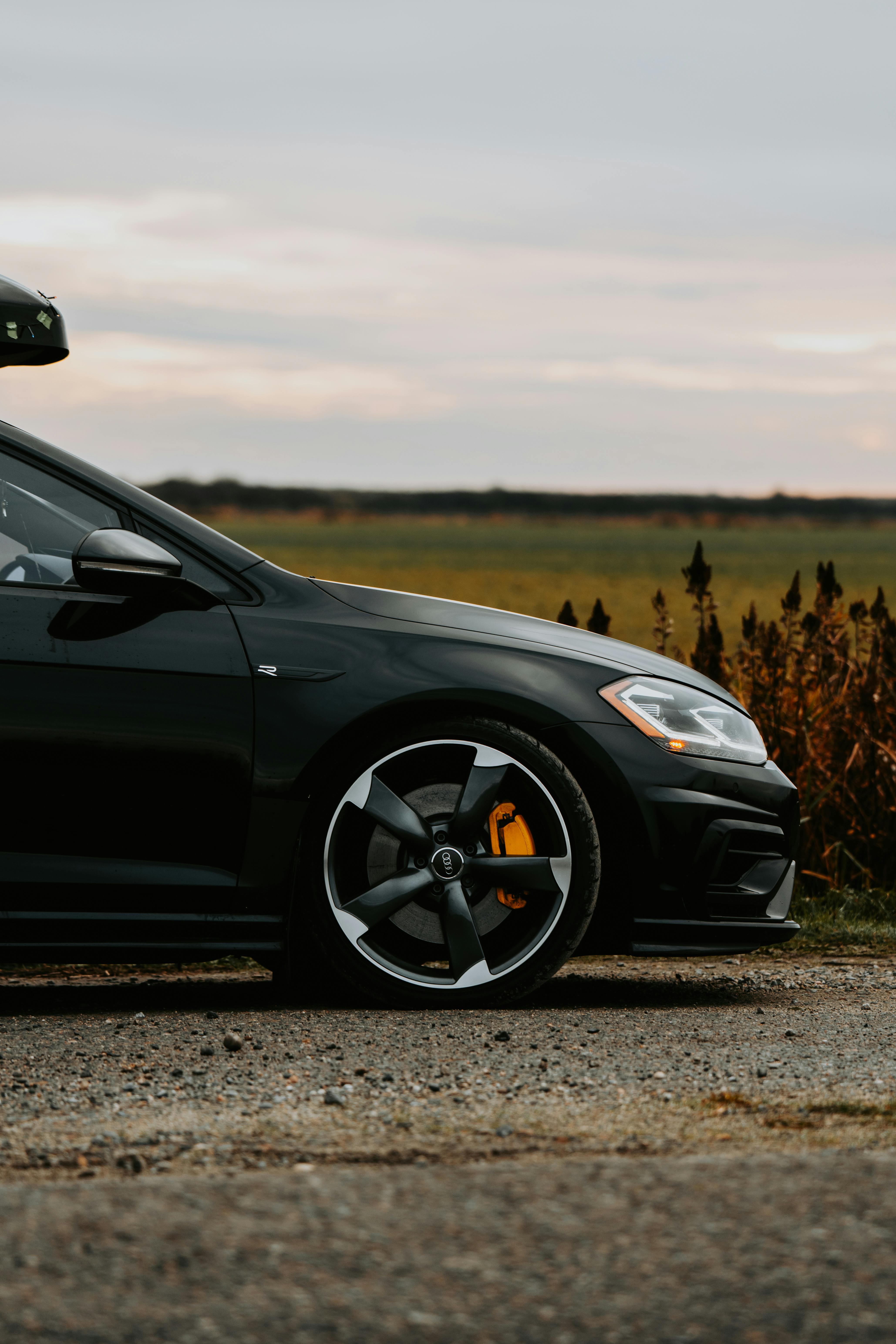 Sleek Black Car with Modern Alloy Wheels Outdoors · Free Stock Photo