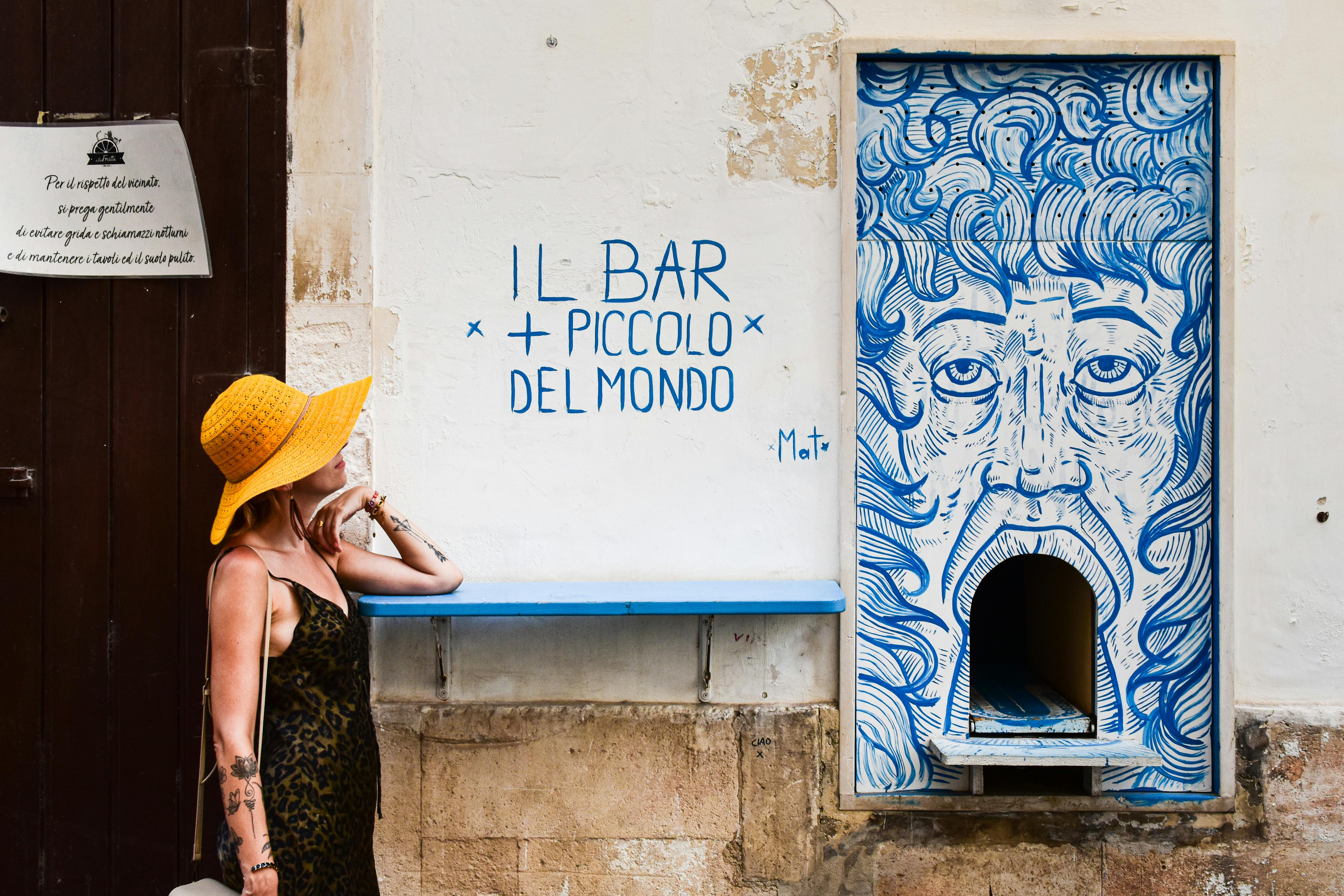Woman Admiring Quirky Bar in Apulia, Italy · Free Stock Photo