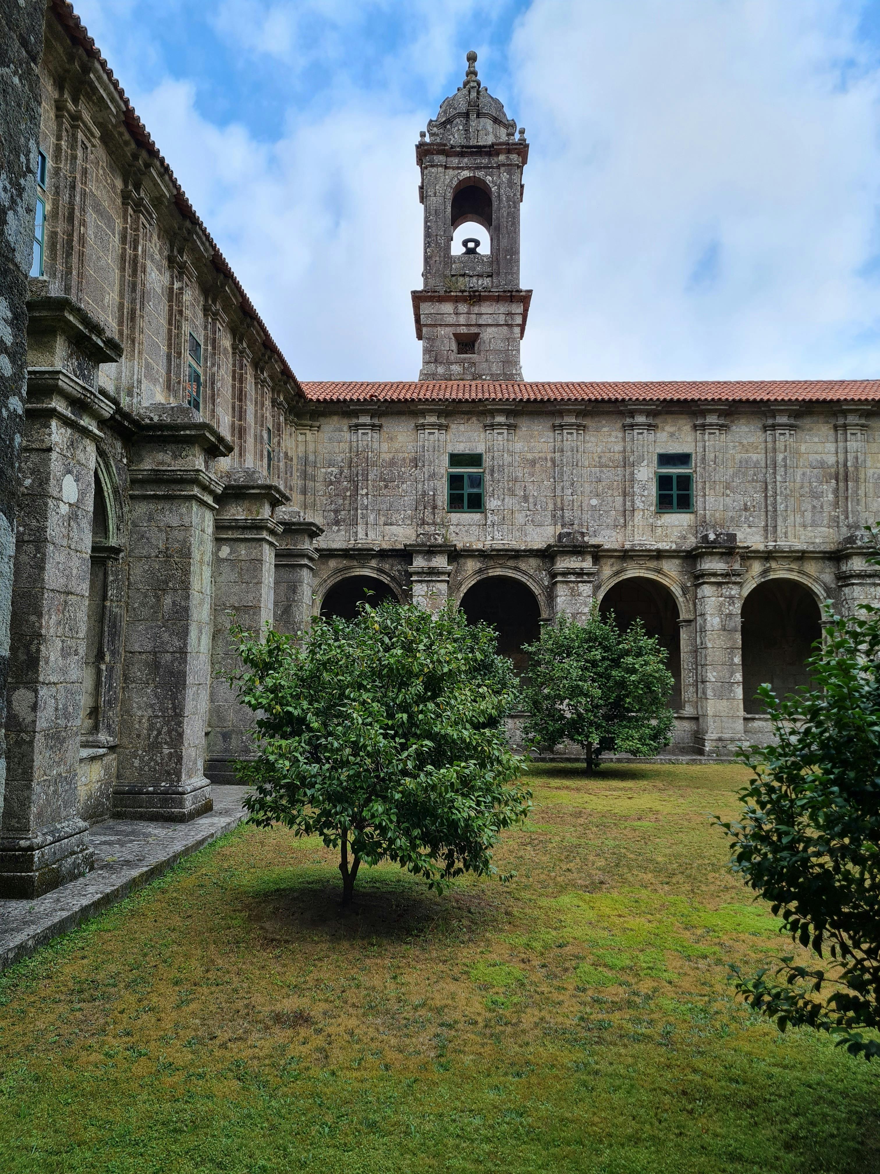 Historic Stone Monastery Courtyard with Tower · Free Stock Photo