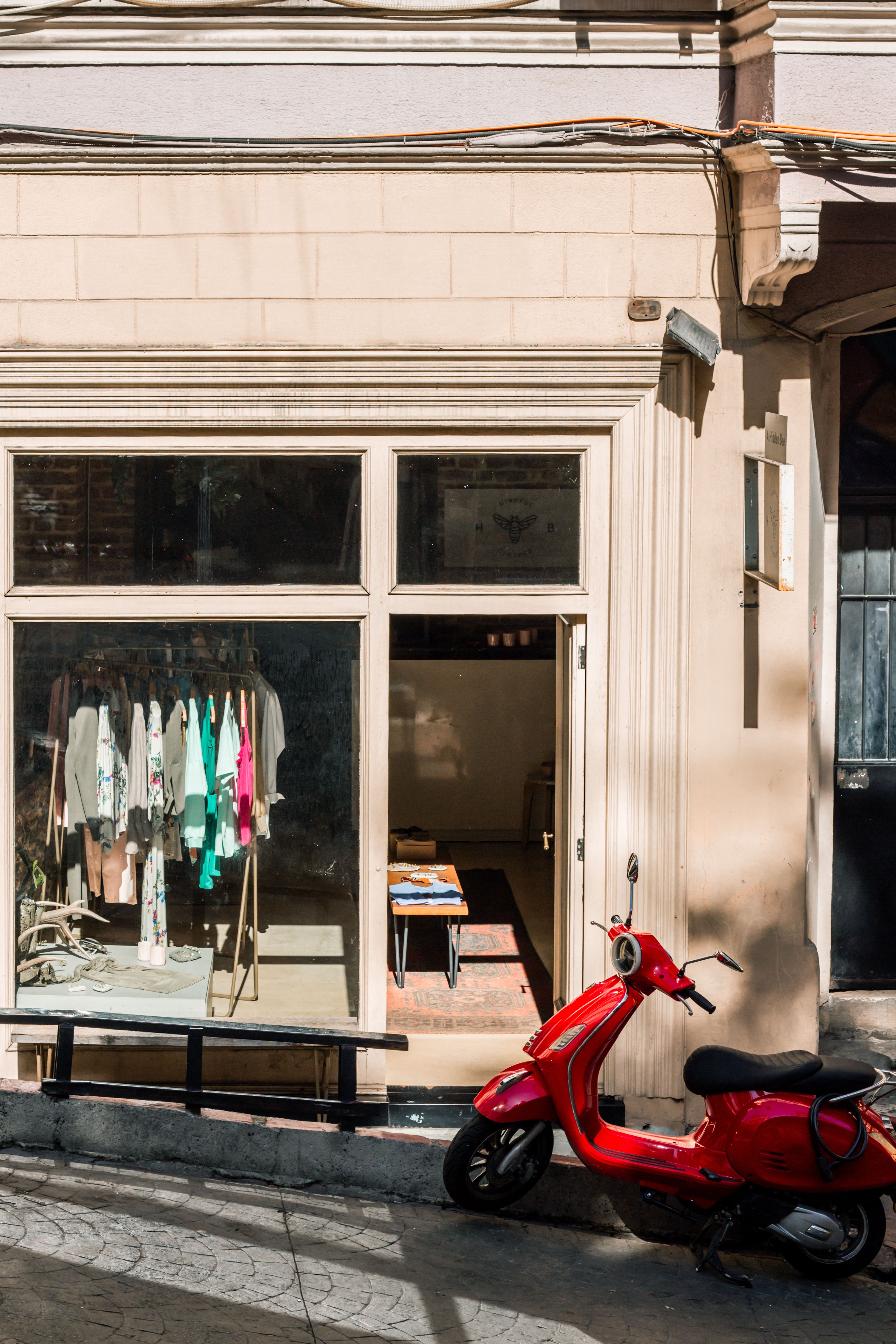 Charming Boutique with Vintage Red Scooter Outside · Free Stock Photo