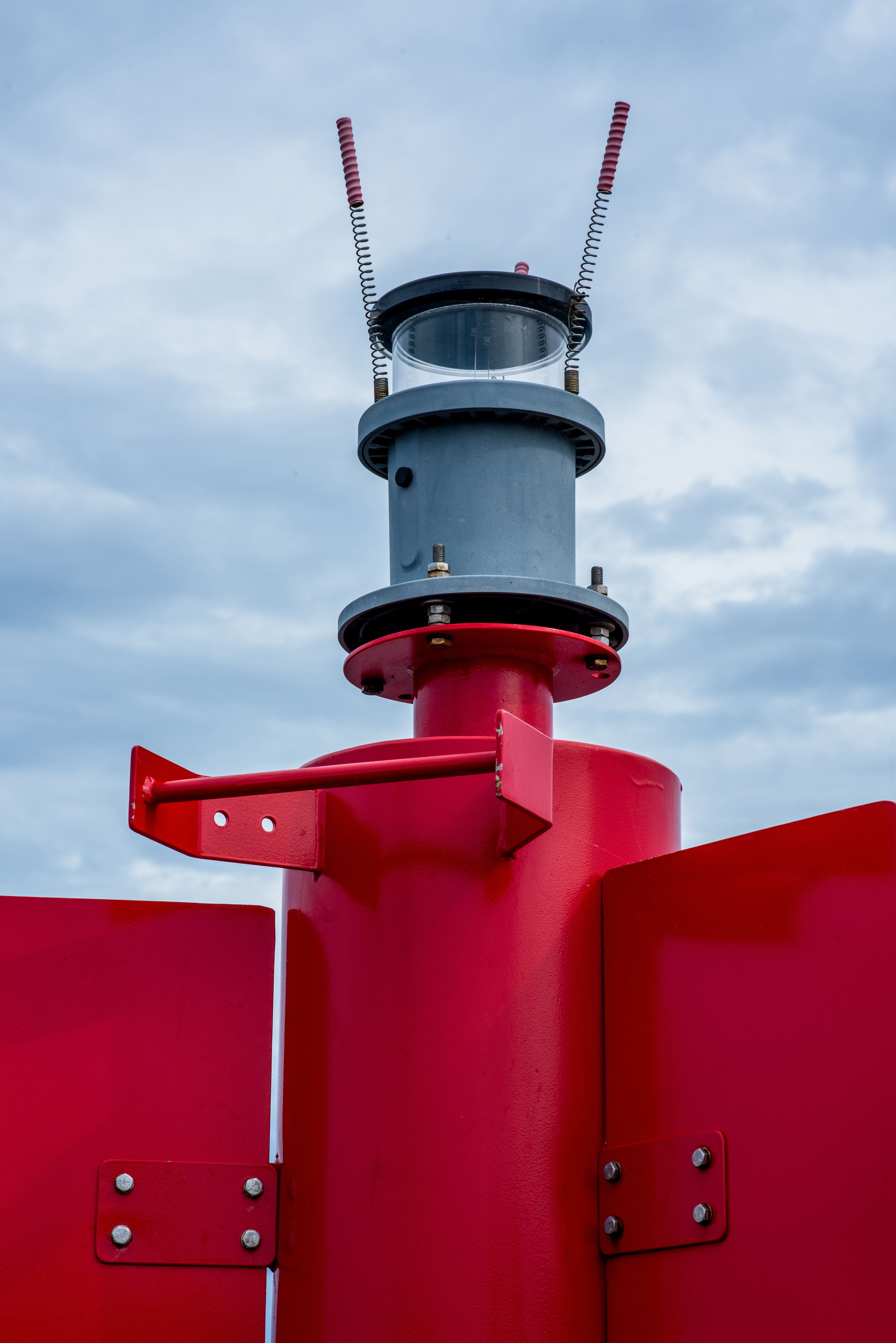 Red Nautical Beacon Against Cloudy Sky · Free Stock Photo