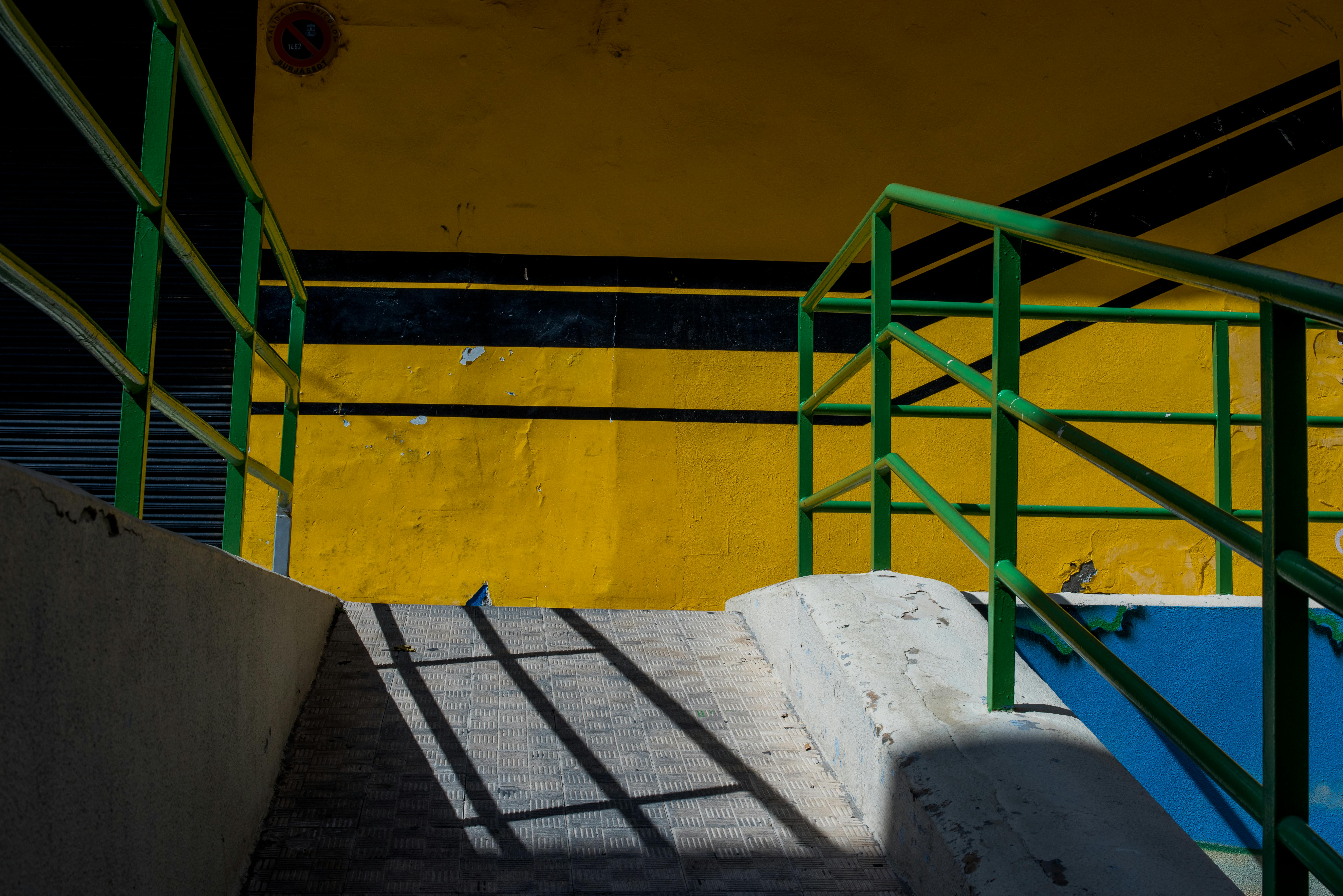 Vibrant Urban Staircase with Colorful Railings · Free Stock Photo