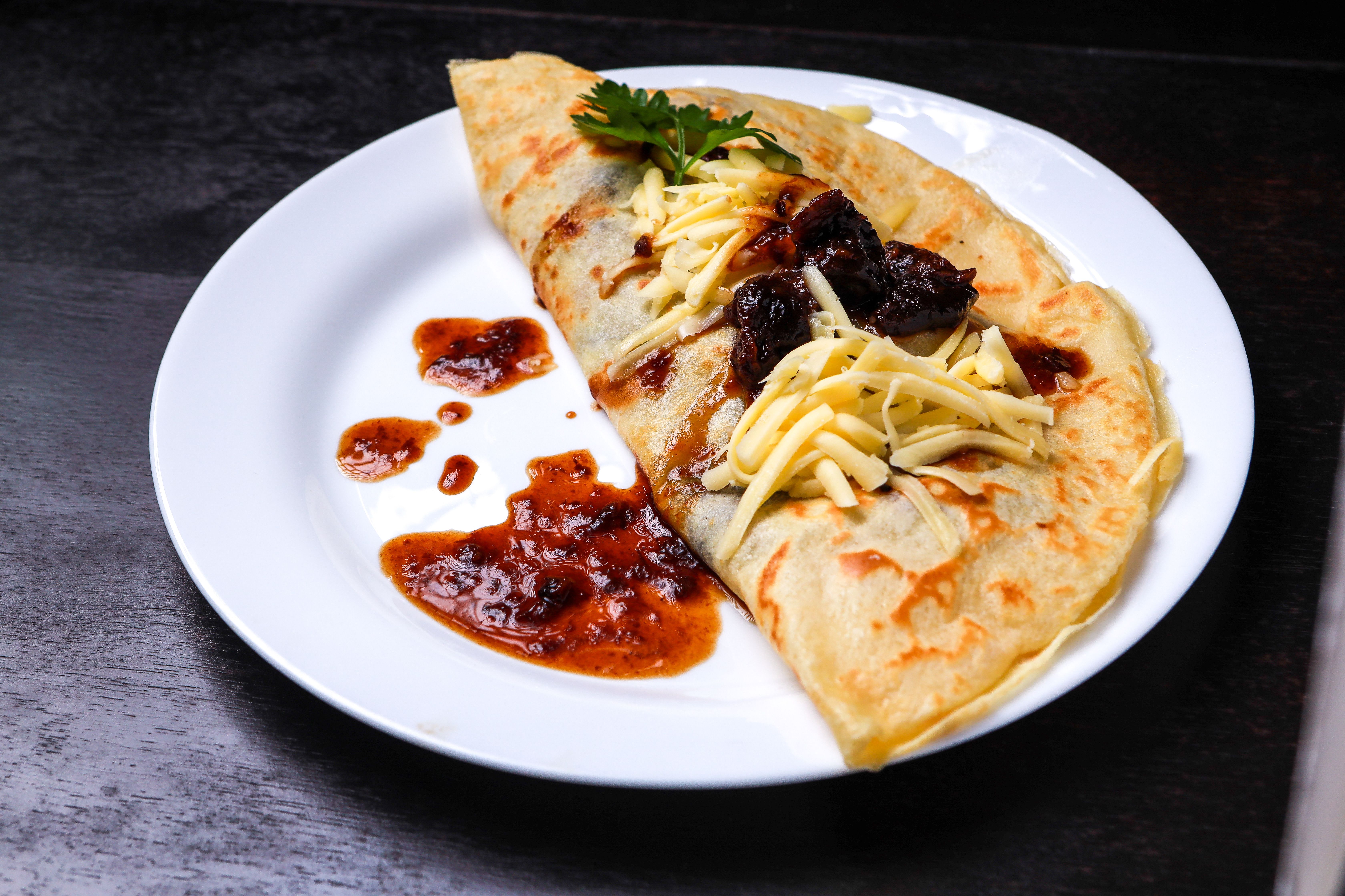Delicious Crepe with Cheese and Jam on White Plate · Free Stock Photo