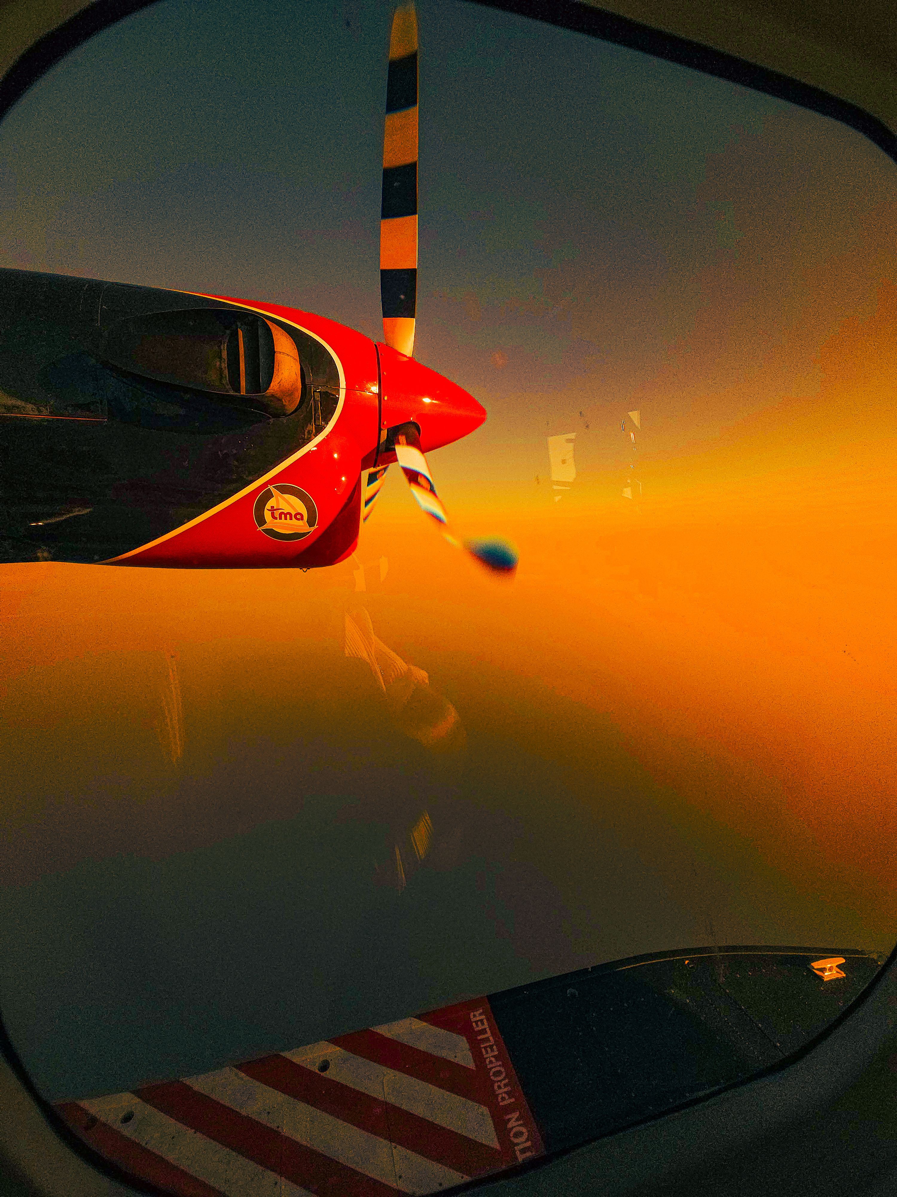Vibrant Propeller Plane Sunrise View from Window · Free Stock Photo
