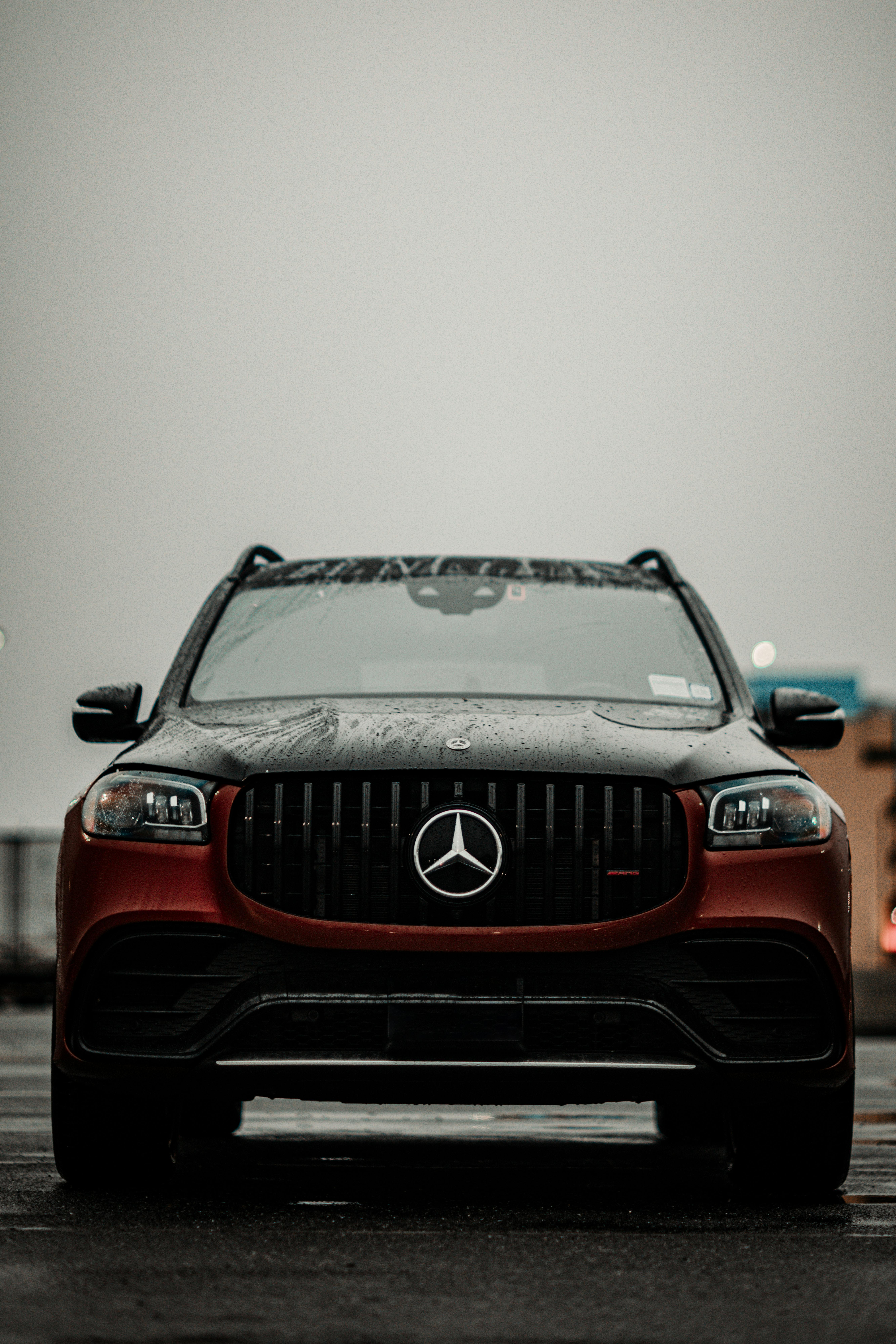 Luxury Car Front View on Rainy Evening · Free Stock Photo