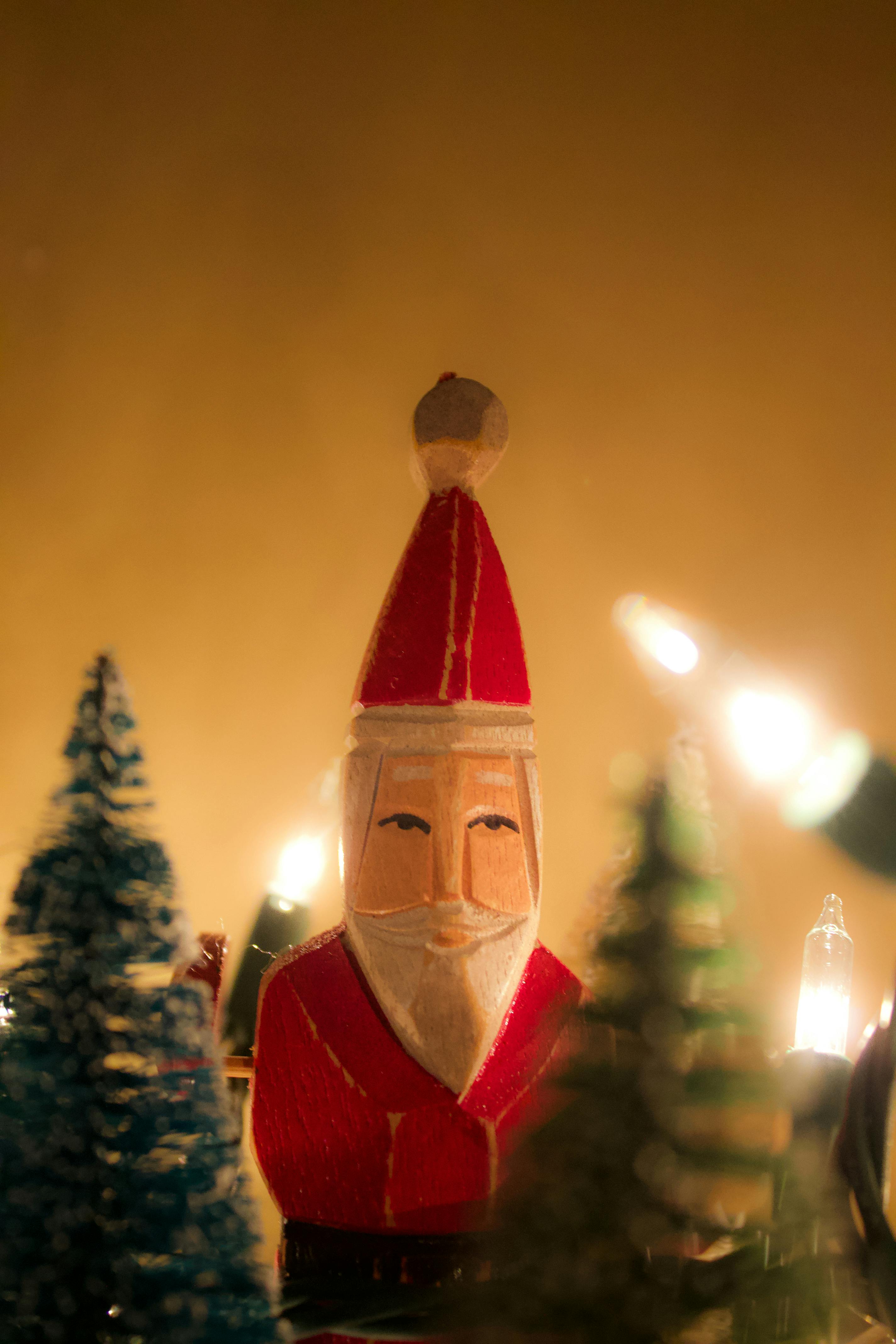 Festive Wooden Santa with Glowing Lights · Free Stock Photo