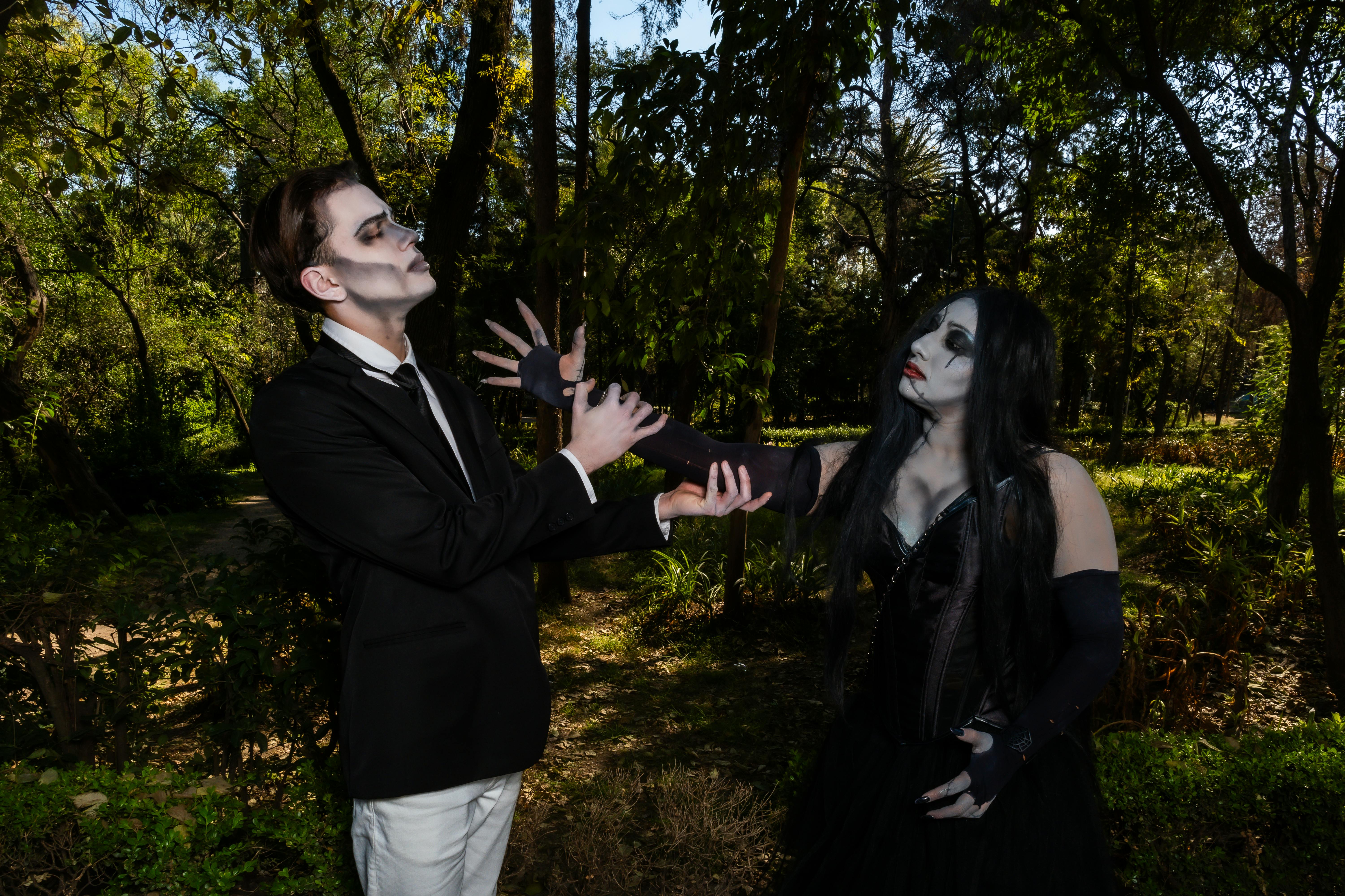 Dramatic Gothic Couple in a Forest Setting · Free Stock Photo