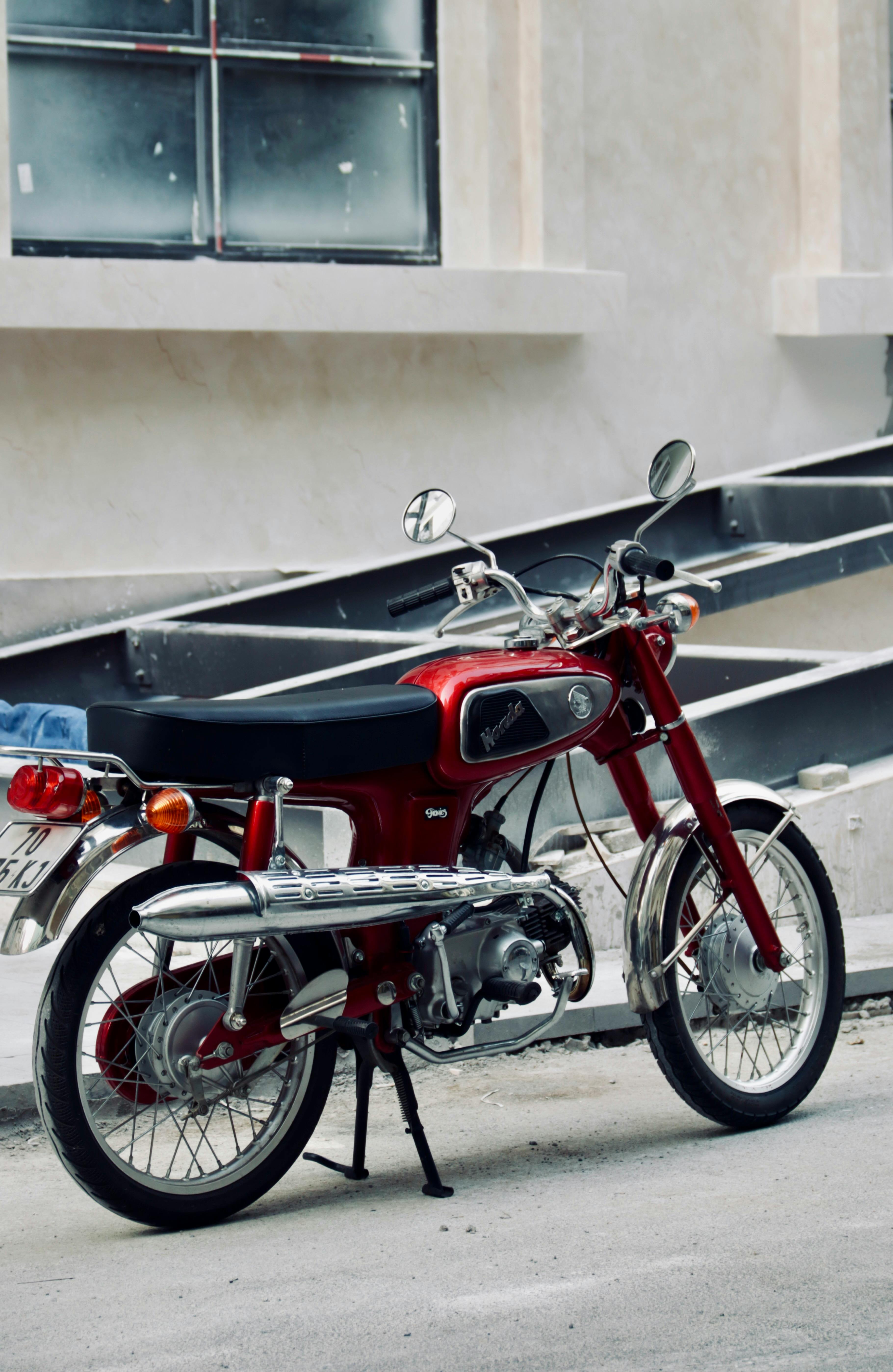 Red Motor Scooter Near Wall · Free Stock Photo