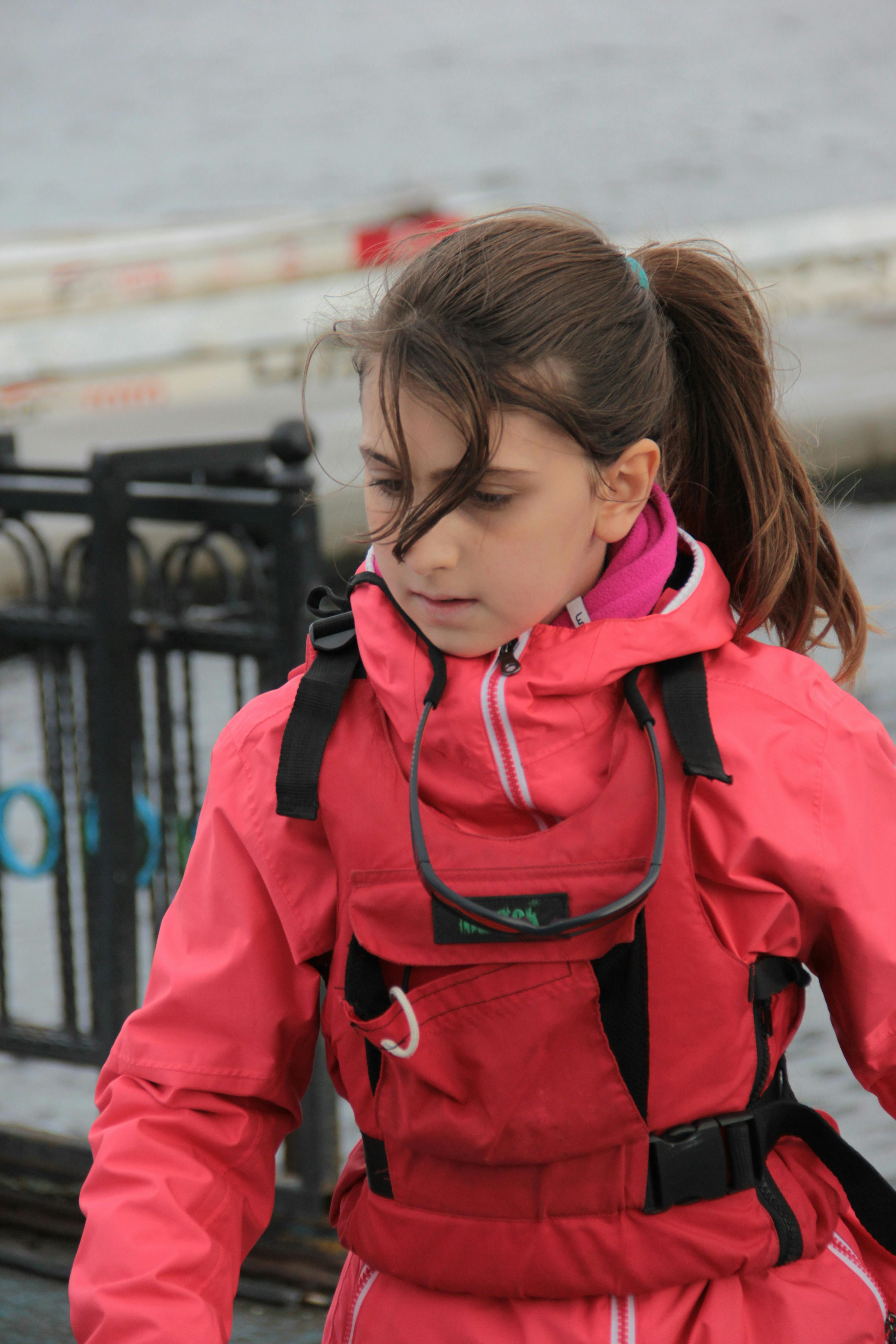 Young Girl in Red Life Vest by Waterfront · Free Stock Photo
