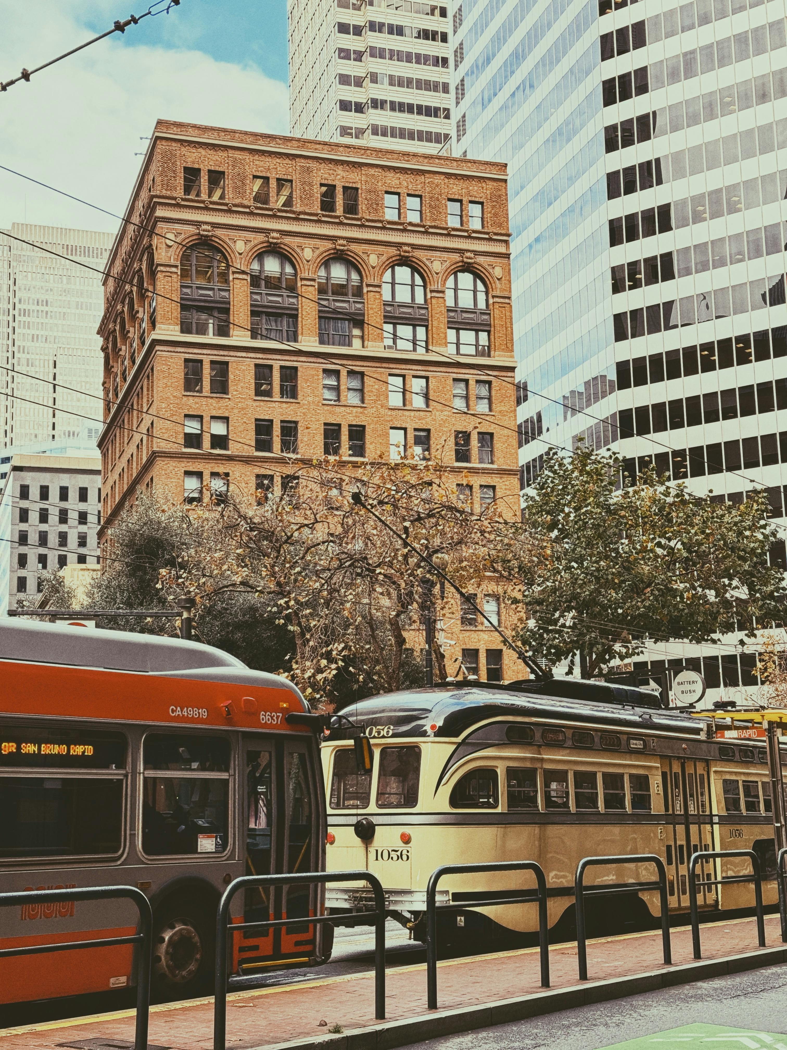 Vintage Streetcars in Downtown Urban Setting · Free Stock Photo