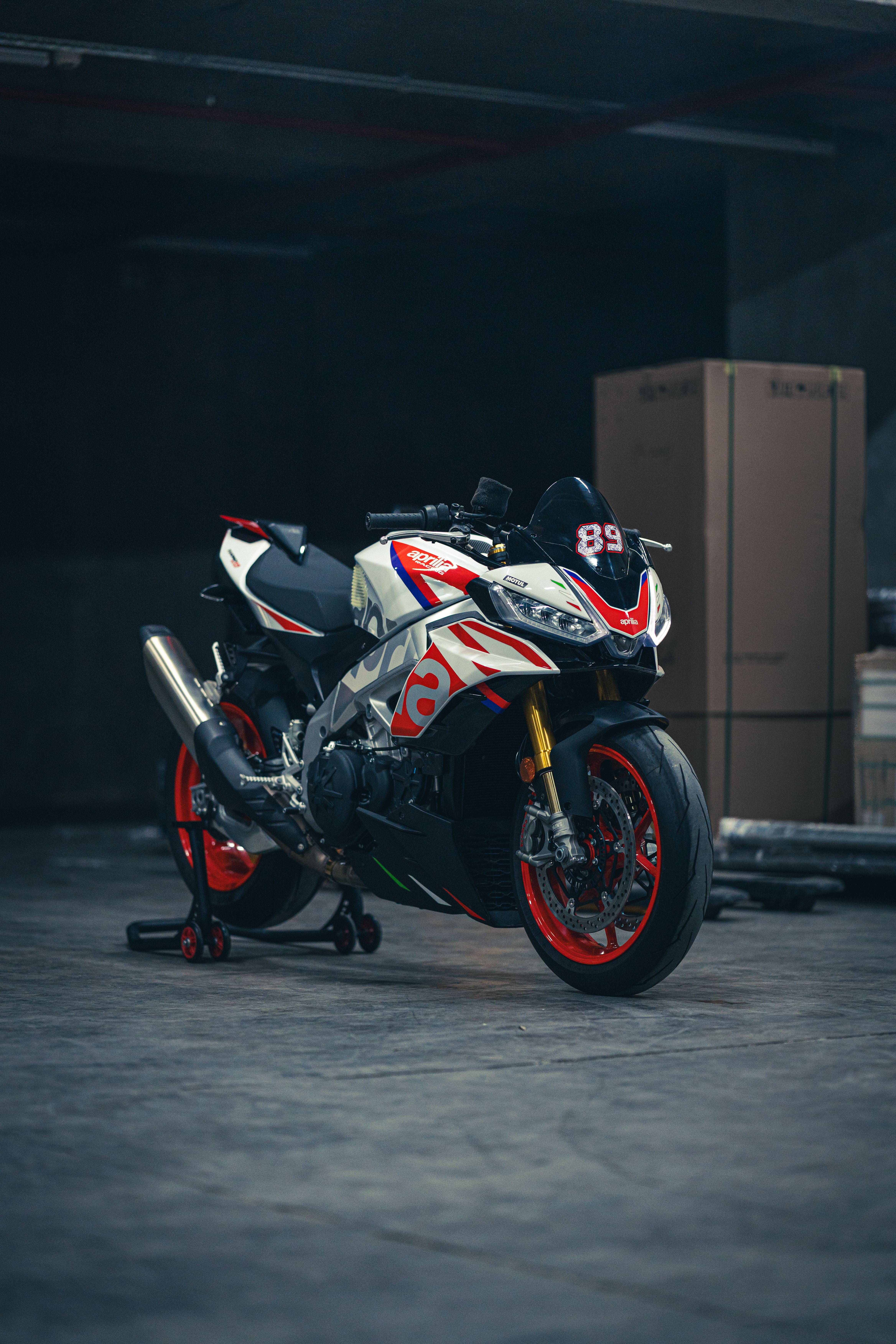 Sleek Black and Red Aprilia Motorcycle on Display · Free Stock Photo