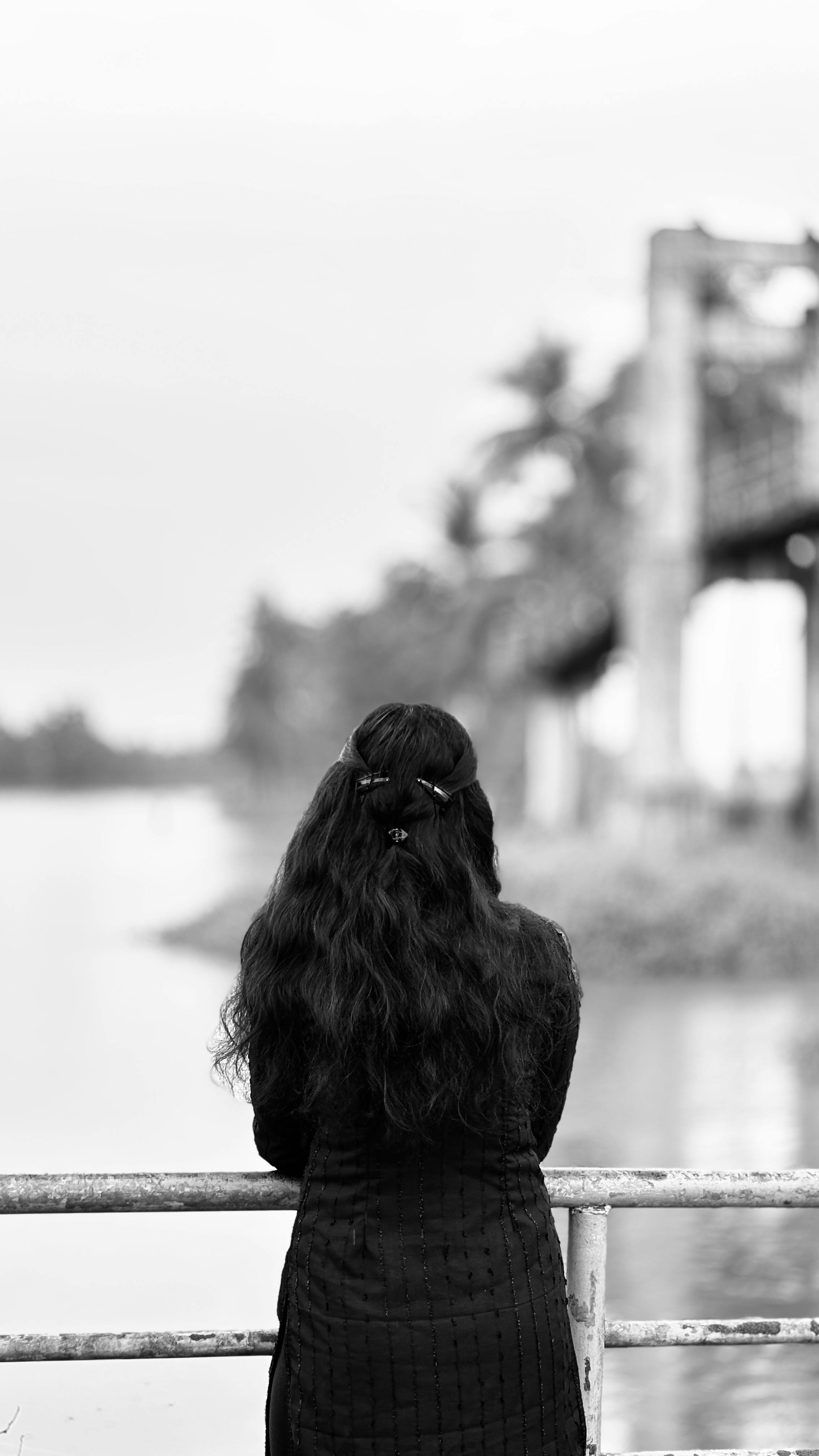 Reflective Woman by Ernakulam River · Free Stock Photo