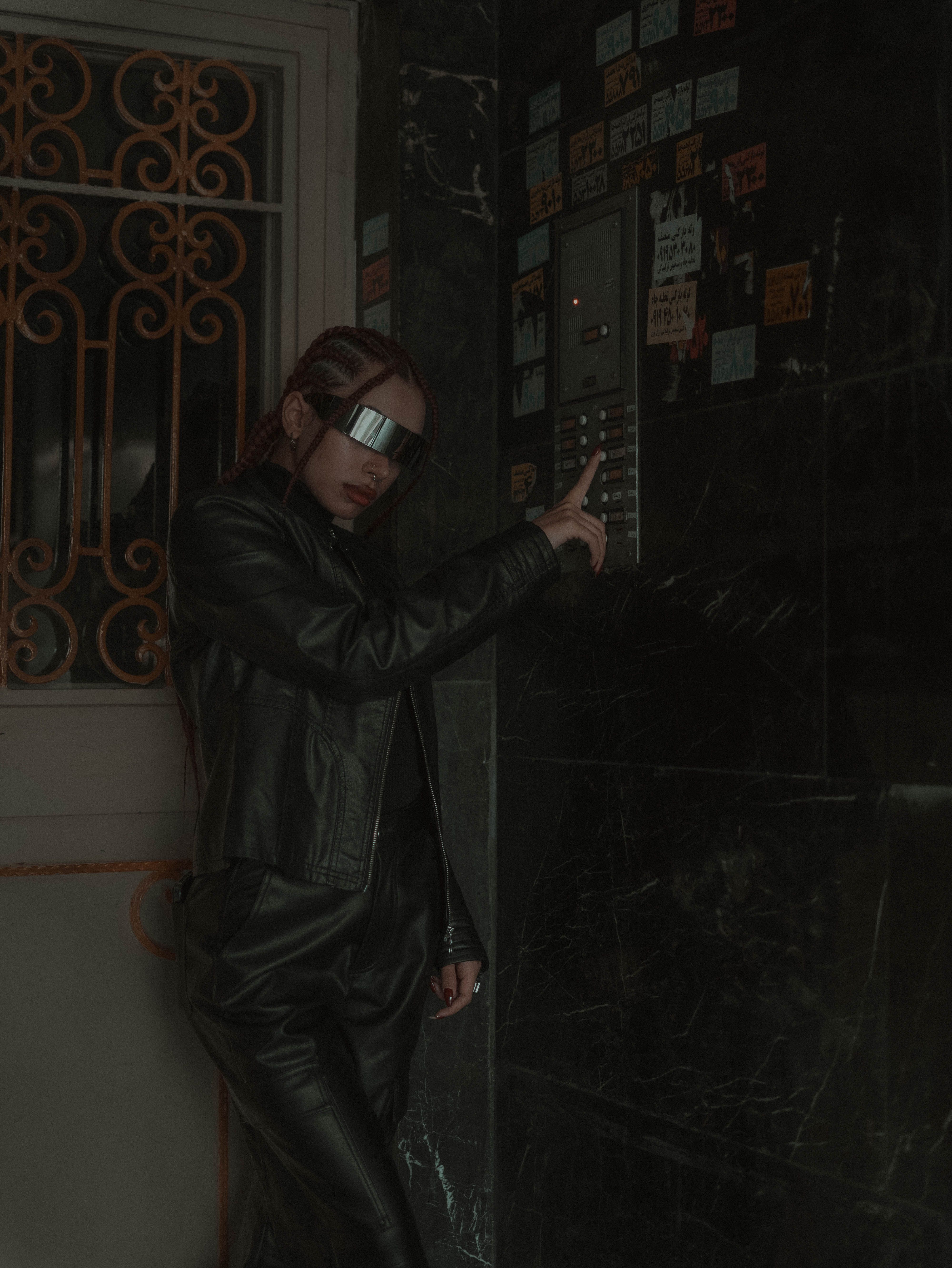 Futuristic Fashion Model in Dark Urban Setting · Free Stock Photo