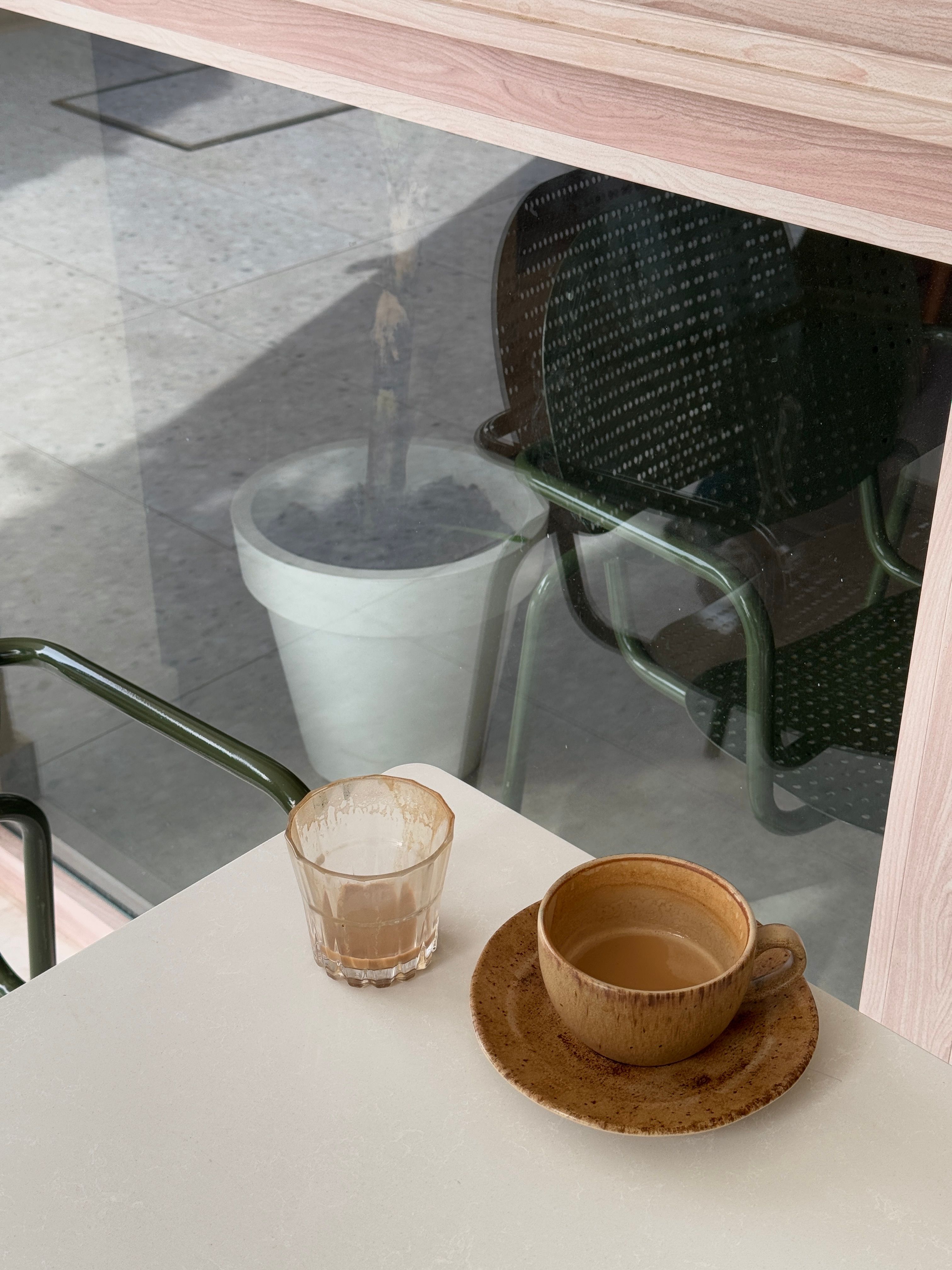 Cozy Cafe Table Setting with Coffee and Glass · Free Stock Photo