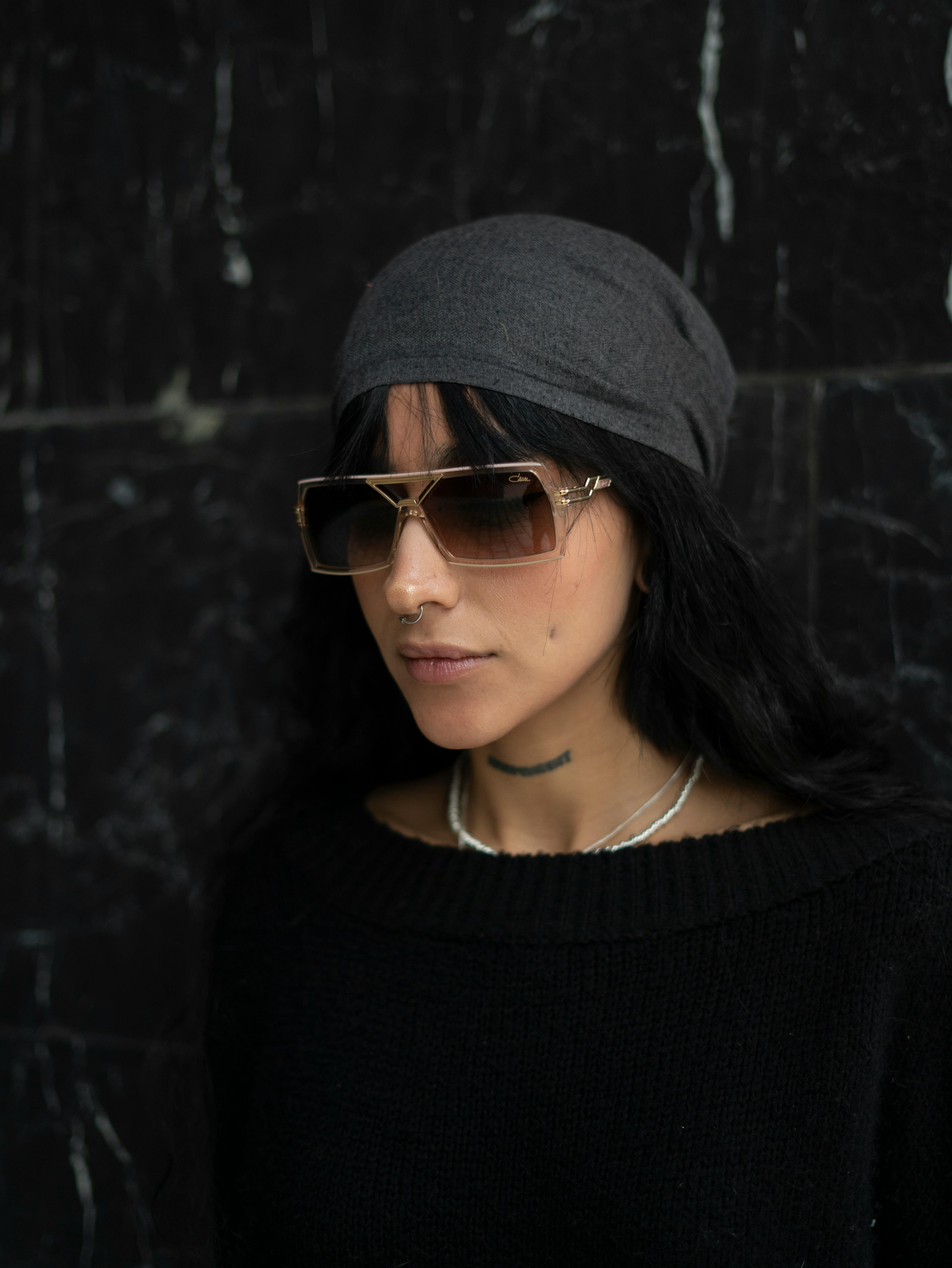 Stylish Woman in Dark Apparel with Sunglasses · Free Stock Photo