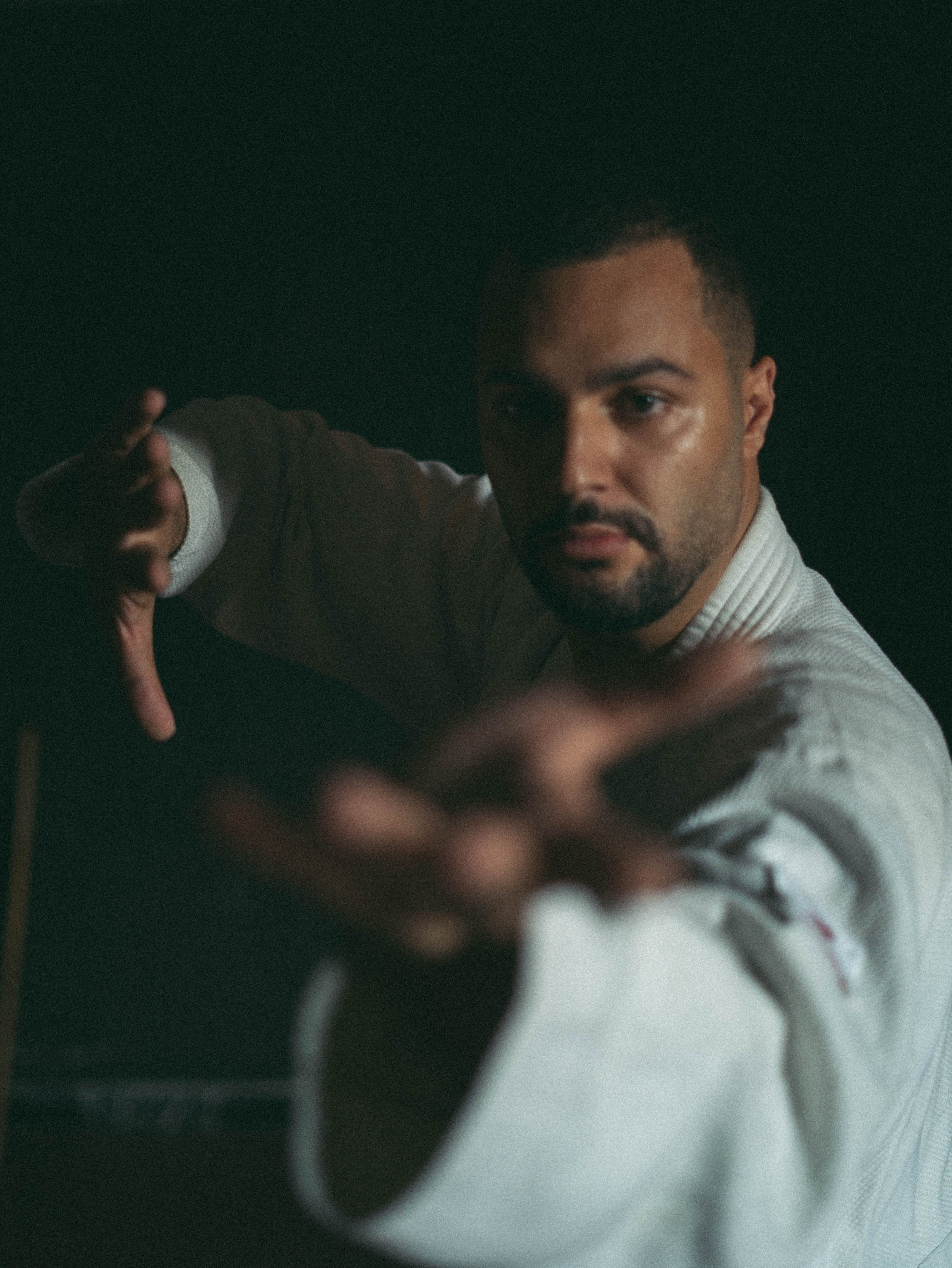 Martial Artist in Focused Kung Fu Pose · Free Stock Photo