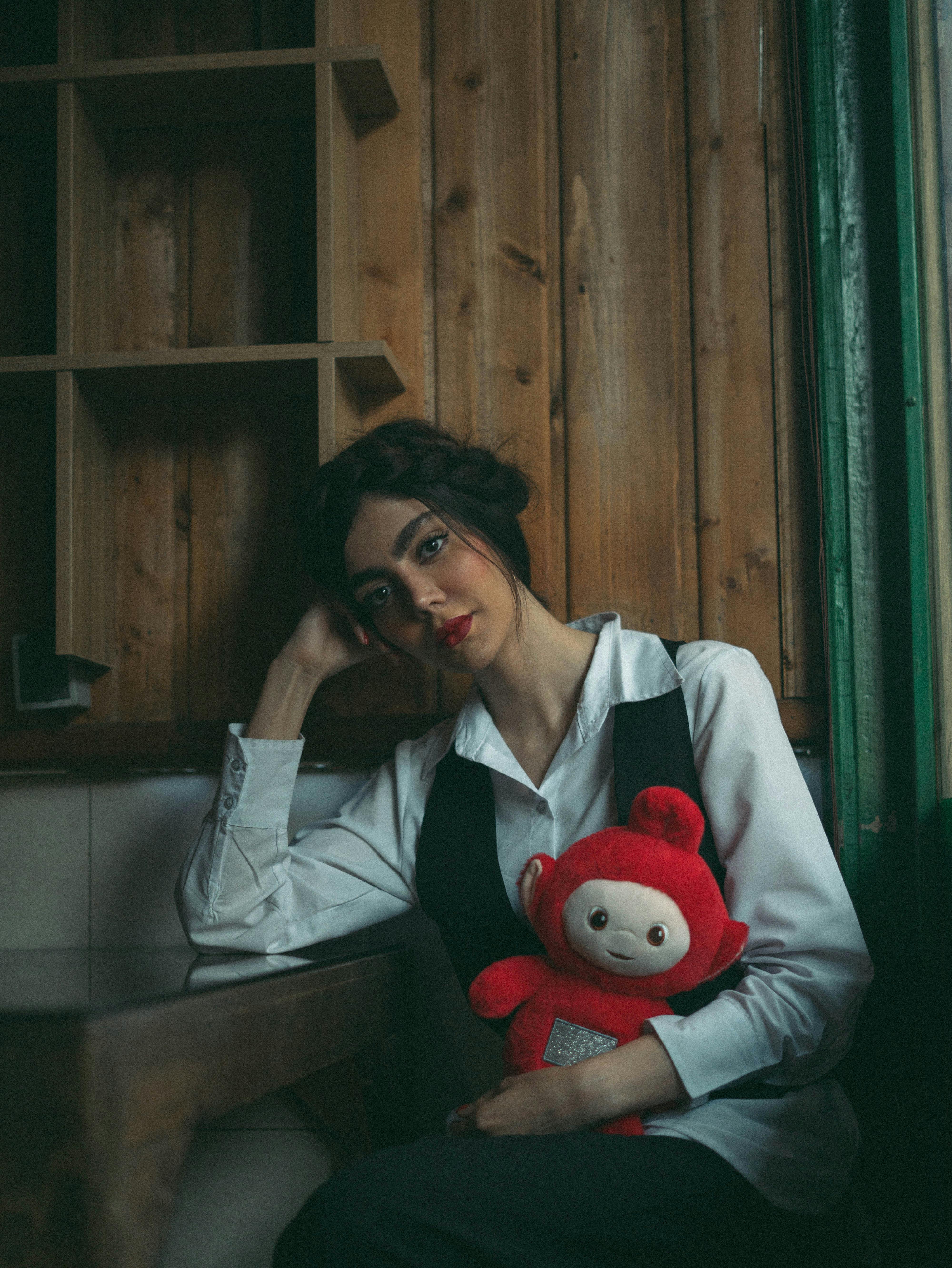 Woman with Toy in Cozy Rustic Interior · Free Stock Photo