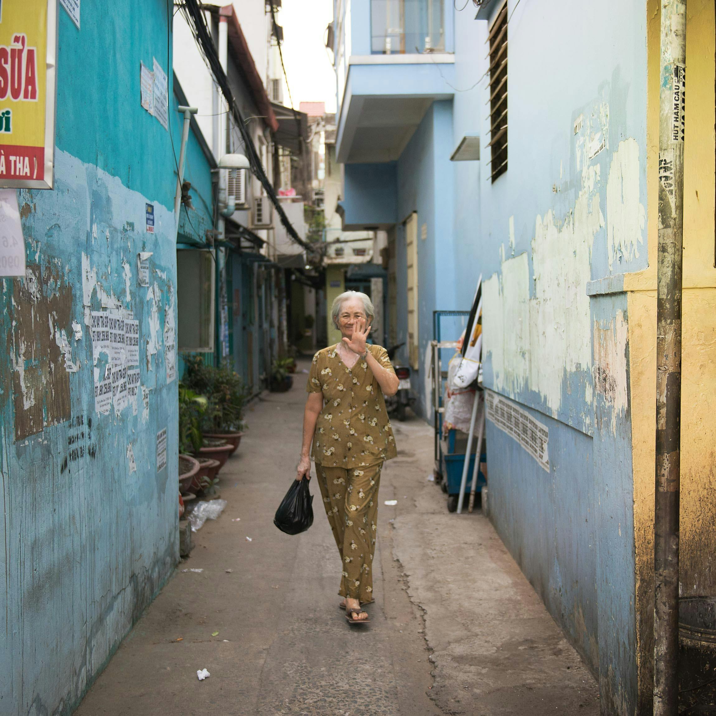 Woman Holding Black Leather Handbag Walking on The Street · Free Stock ...
