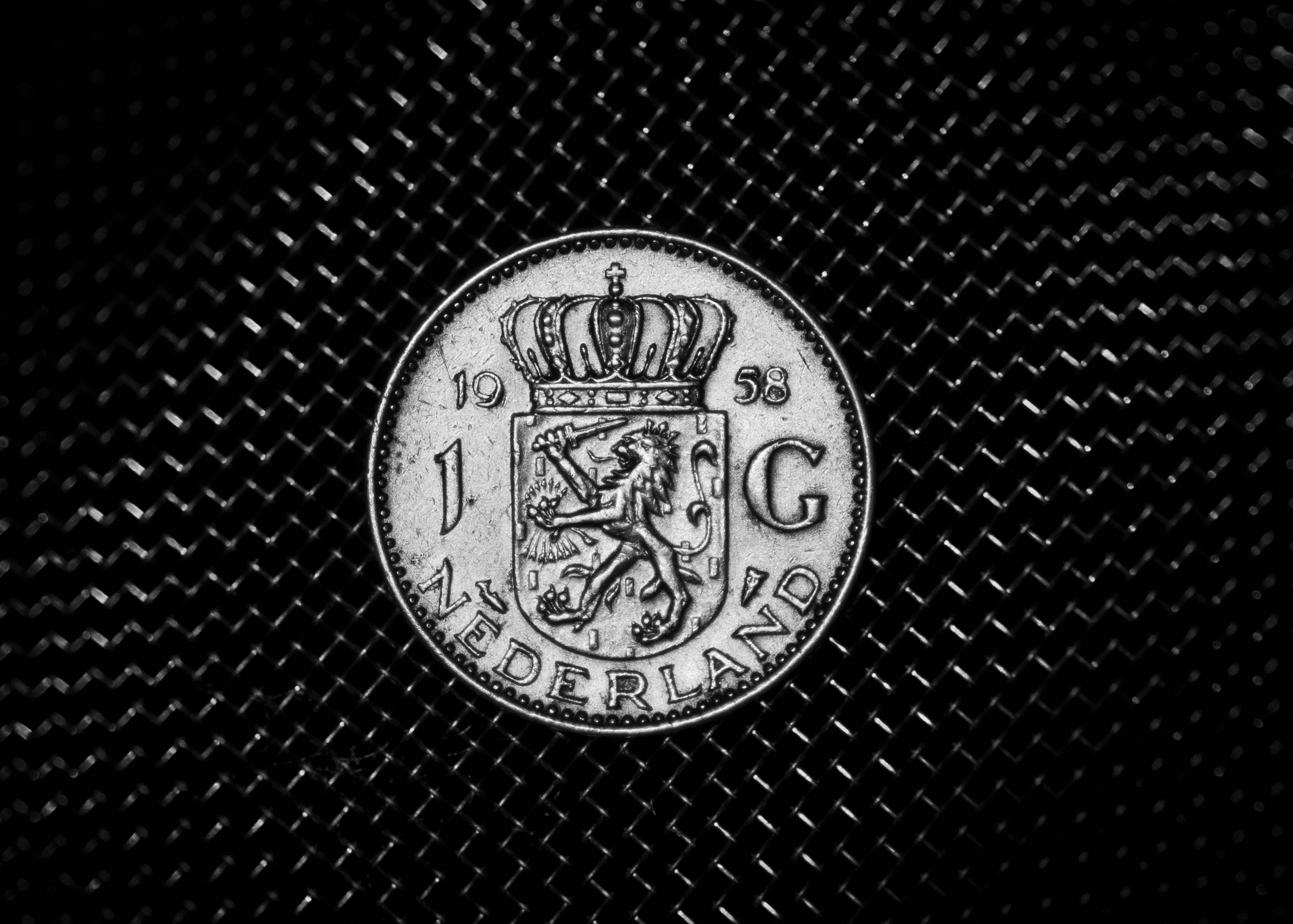 Close-up of Dutch Guilder Coin on Black Surface · Free Stock Photo