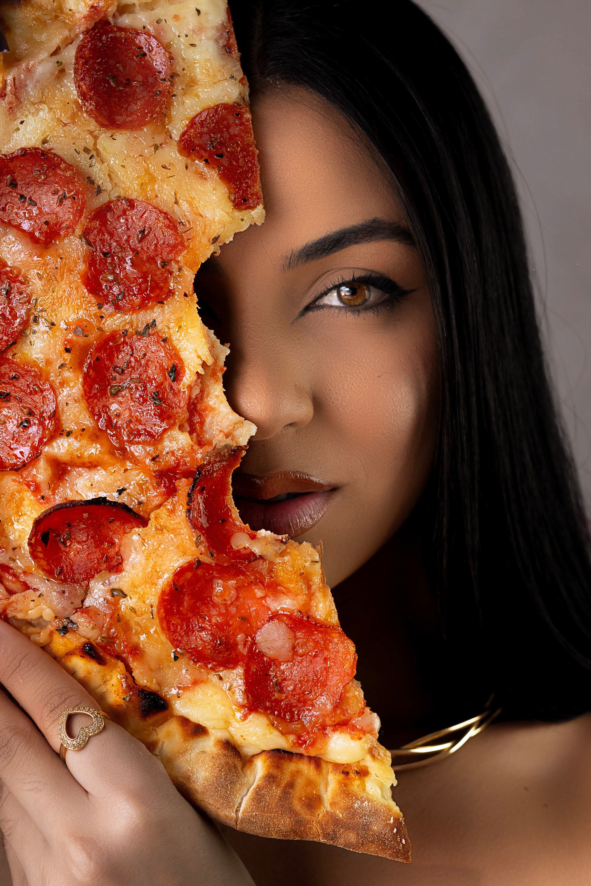 Sensual Portrait With Oversized Pepperoni Pizza Slice · Free Stock Photo