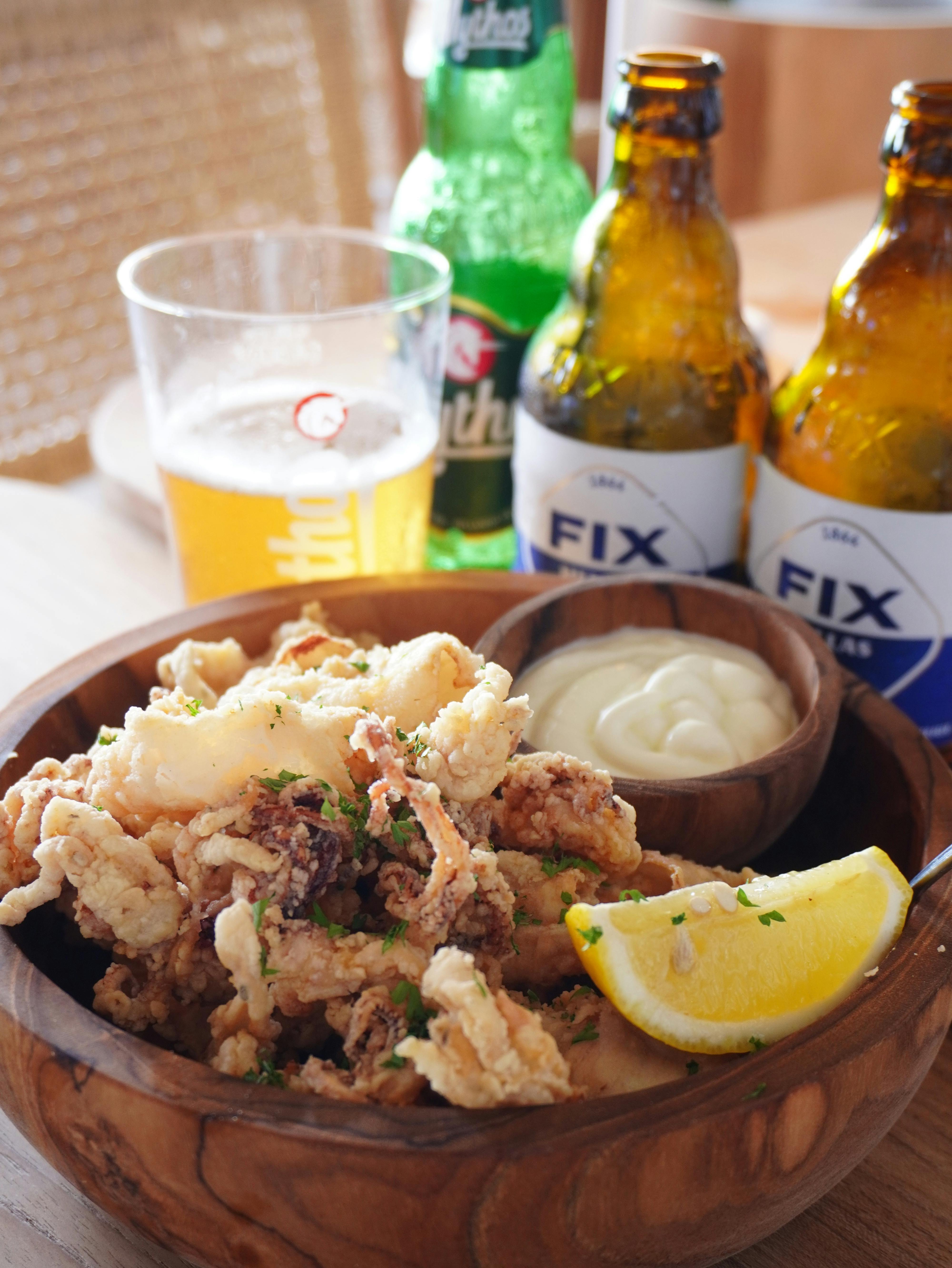 Crispy Fried Calamari with Lemon Wedge and Beer · Free Stock Photo