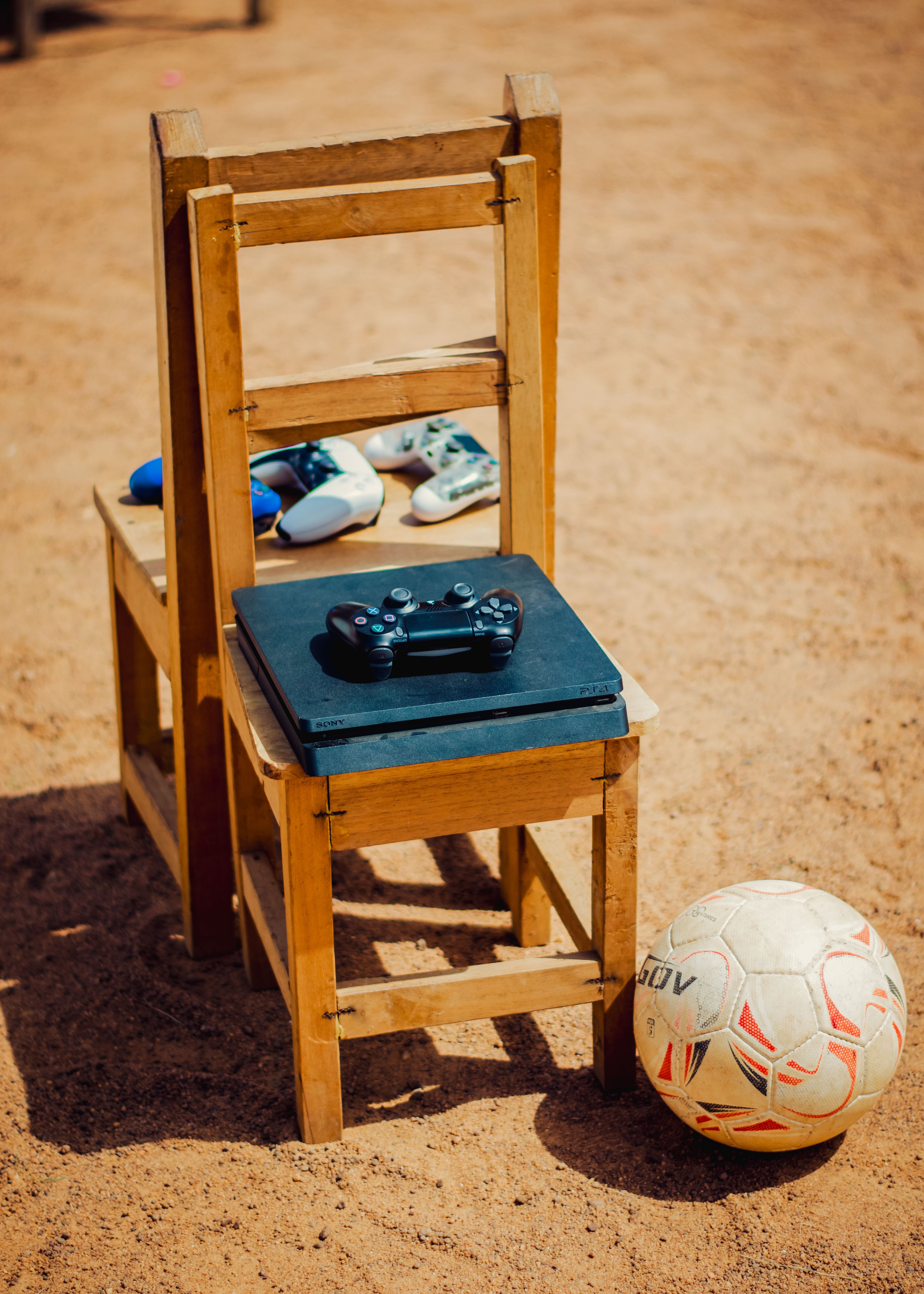 Rustic Outdoor Gaming Setup with Soccer Ball · Free Stock Photo