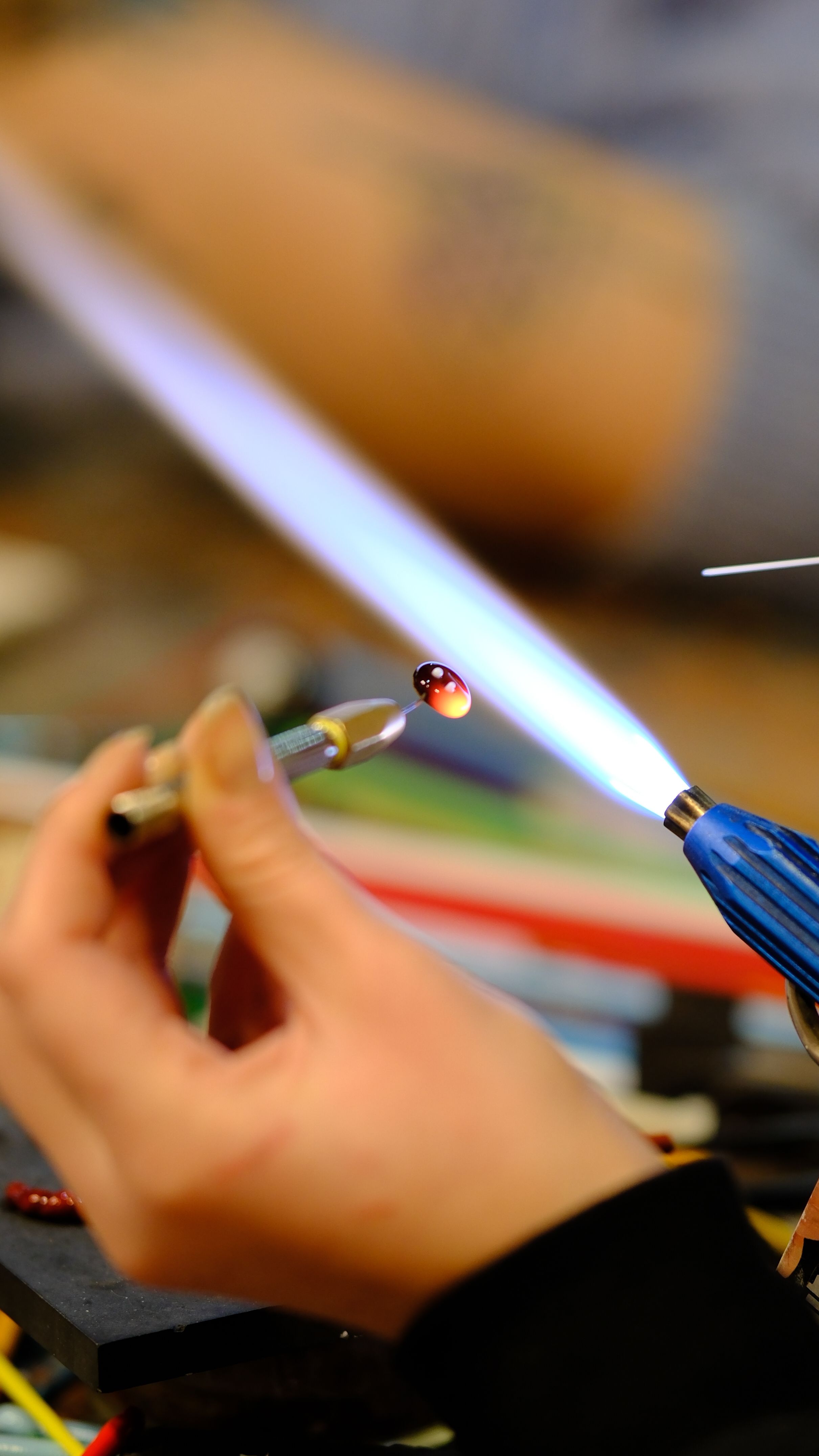 Close-up of Glass Bead Making with Flame · Free Stock Photo
