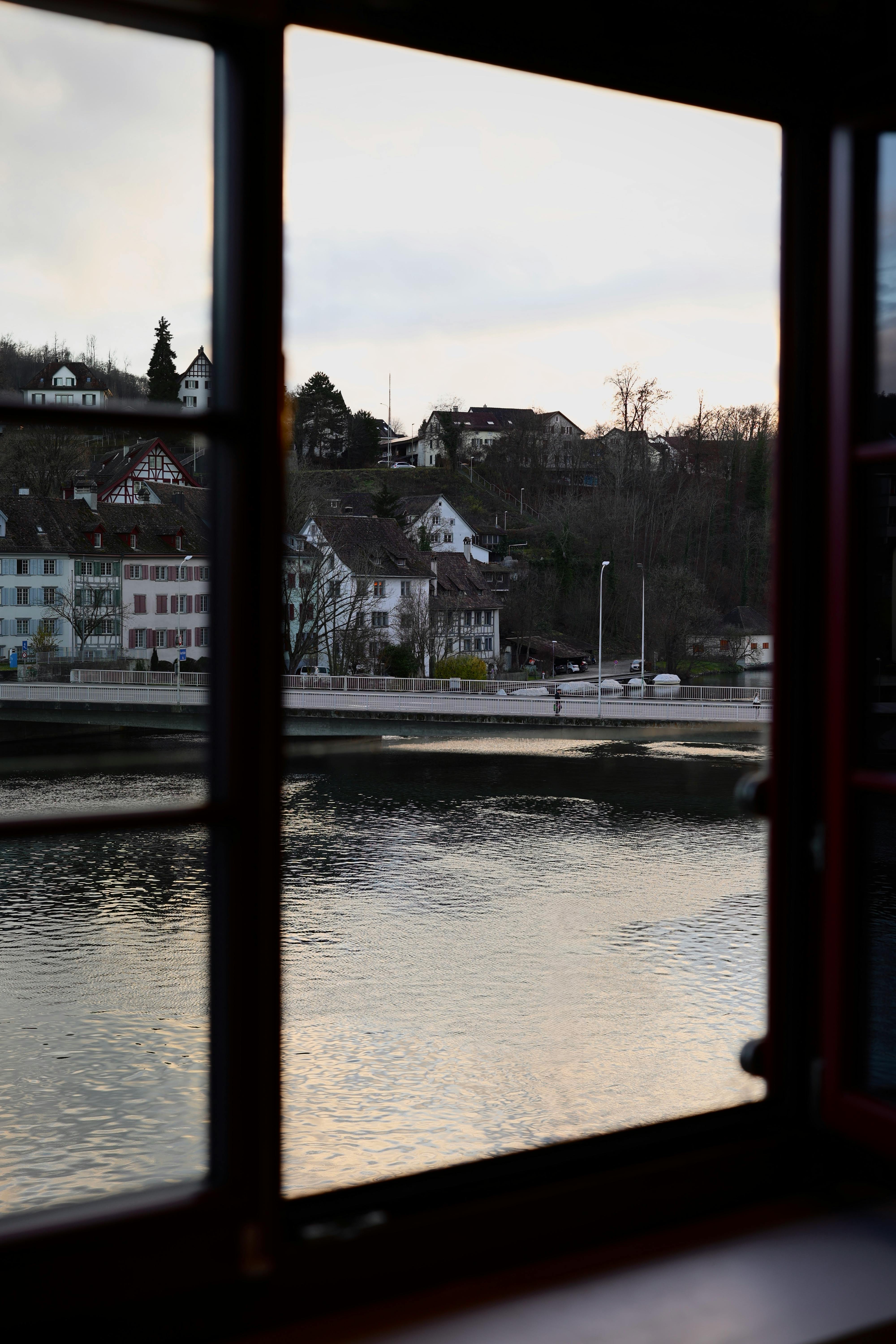 Scenic River View through Window in Schaffhausen · Free Stock Photo