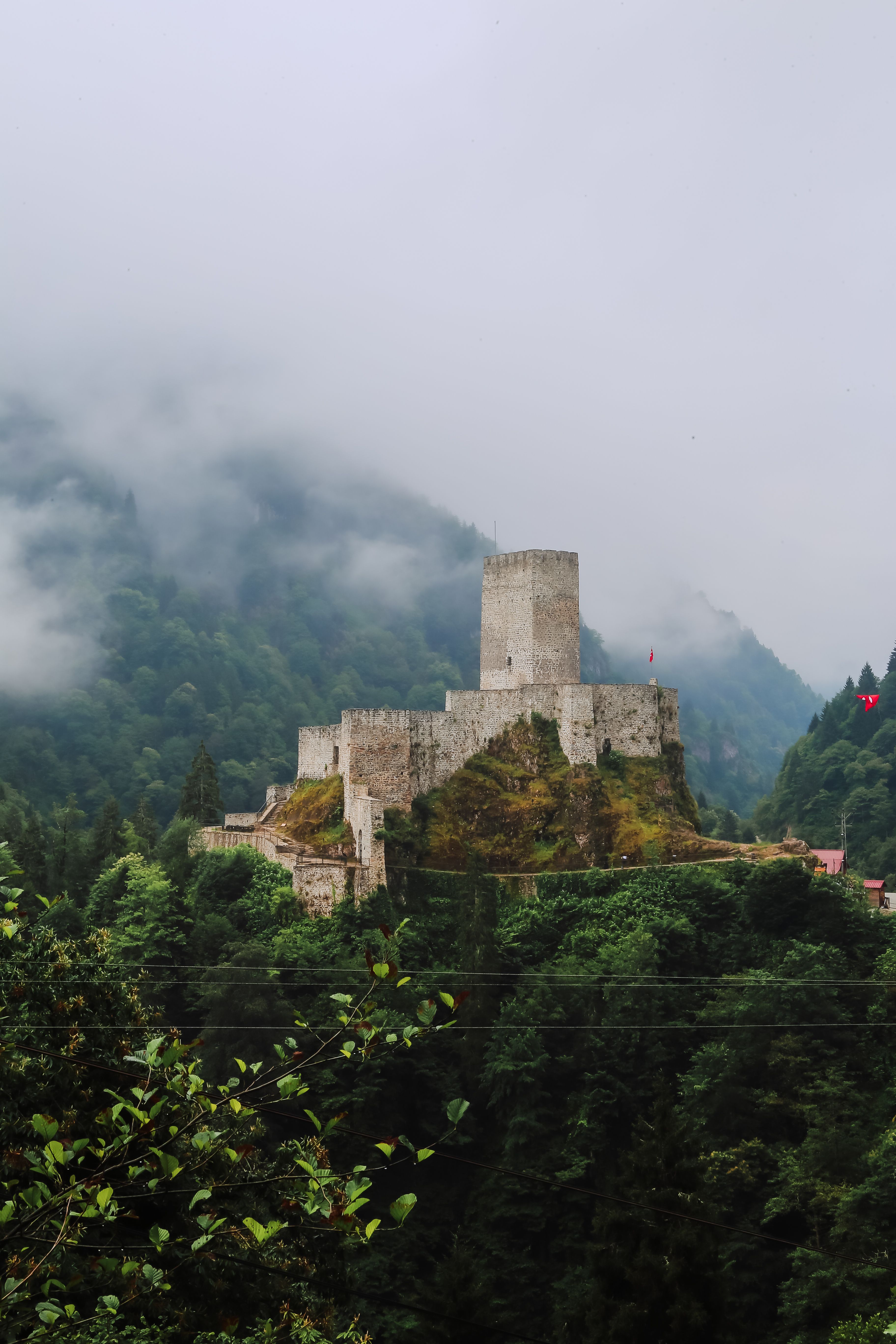 Mysterious Mountain Fortress in Misty Forest · Free Stock Photo