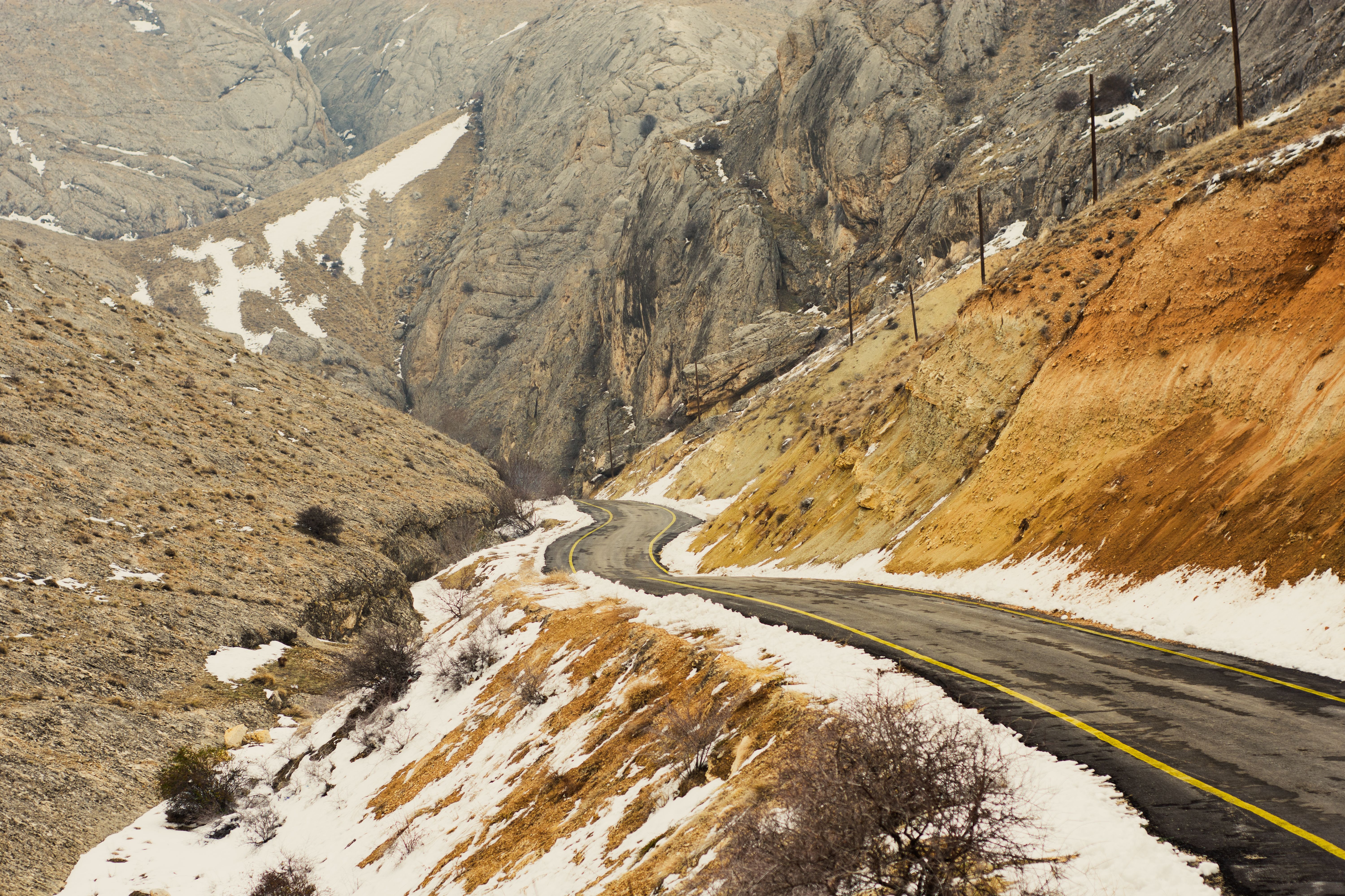 Scenic Snowy Mountain Road in Winter Landscape · Free Stock Photo