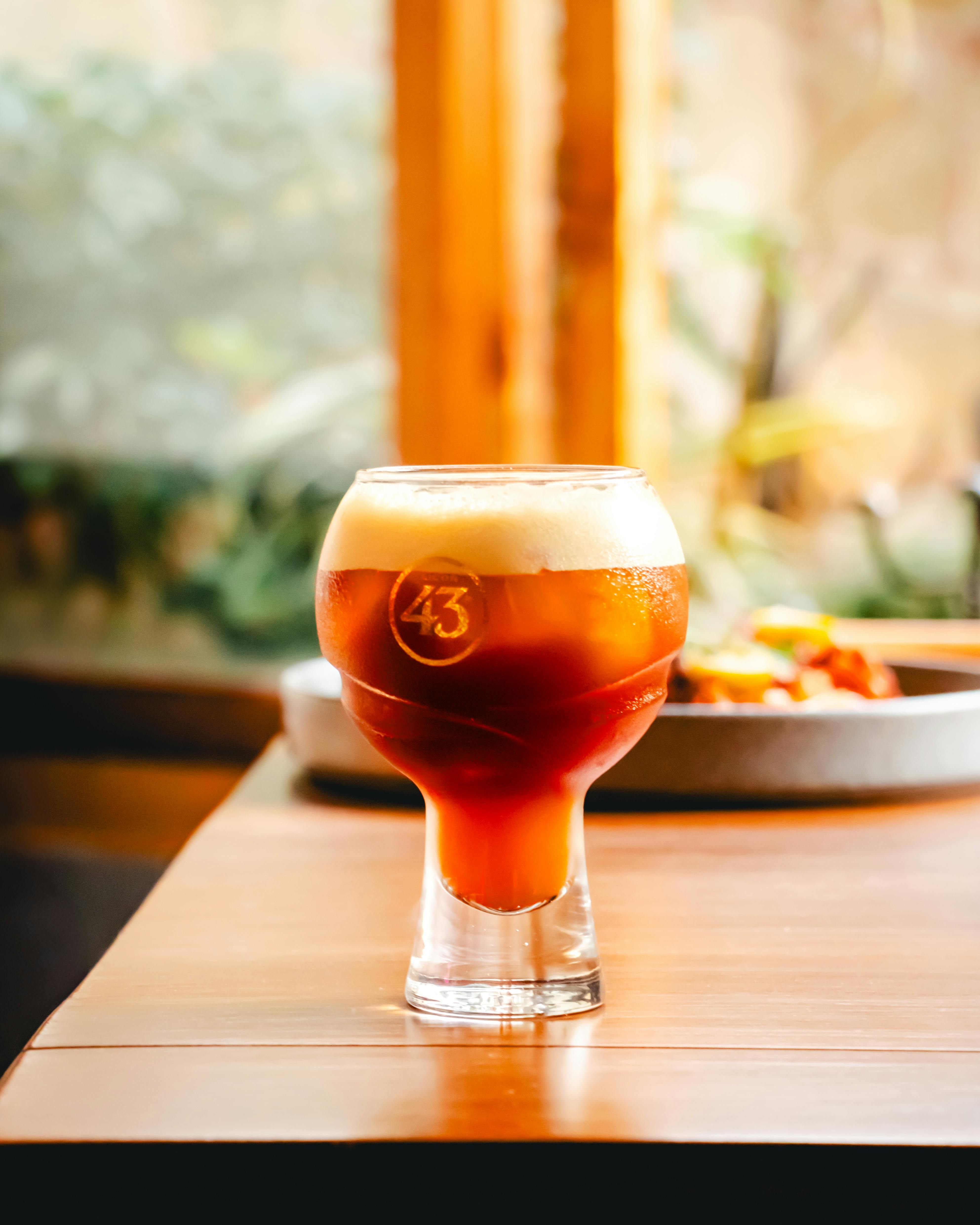 Refreshing Craft Beer in Sunlit Setting · Free Stock Photo