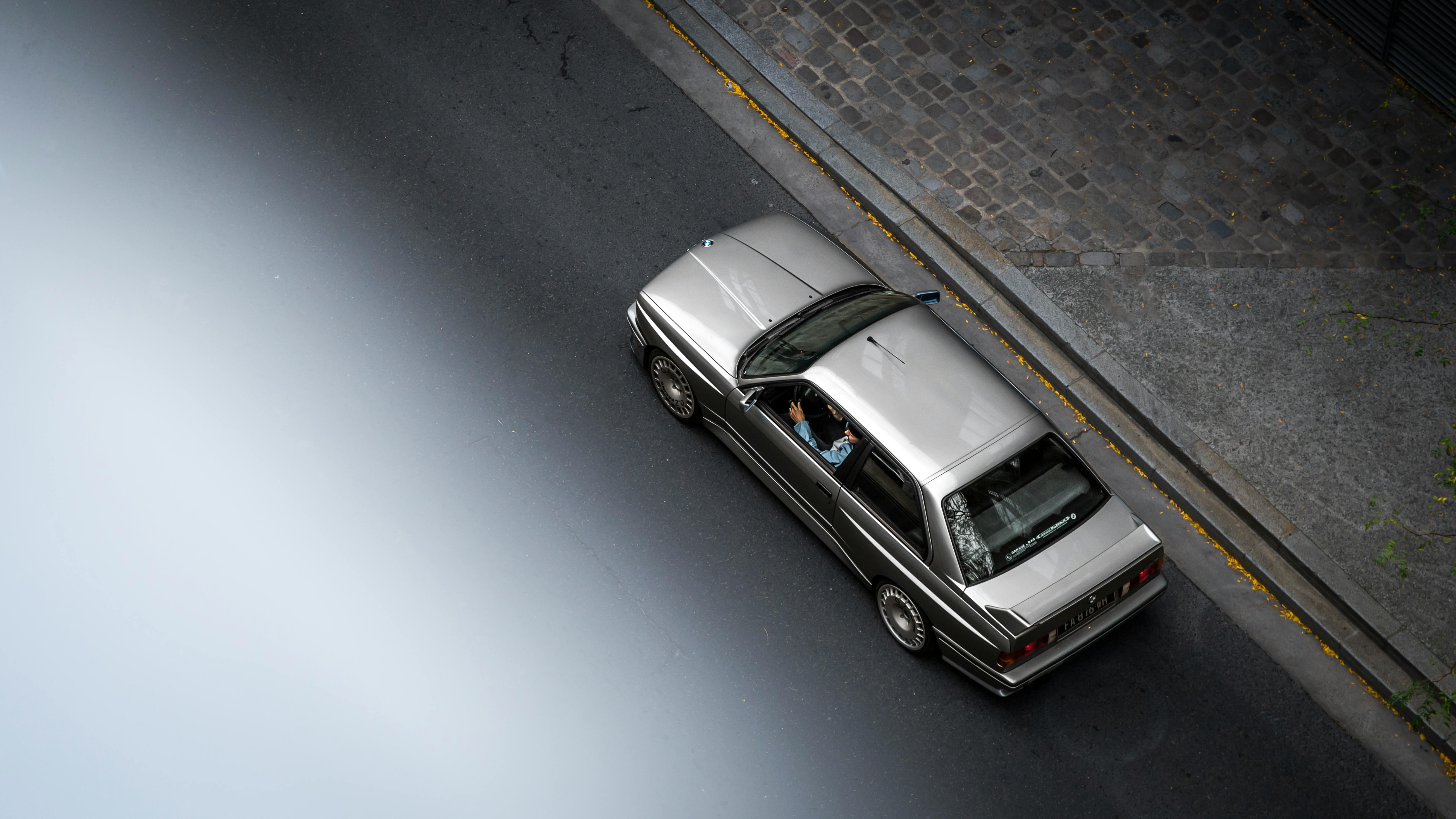 Aerial View of Vintage Car on Urban Street · Free Stock Photo