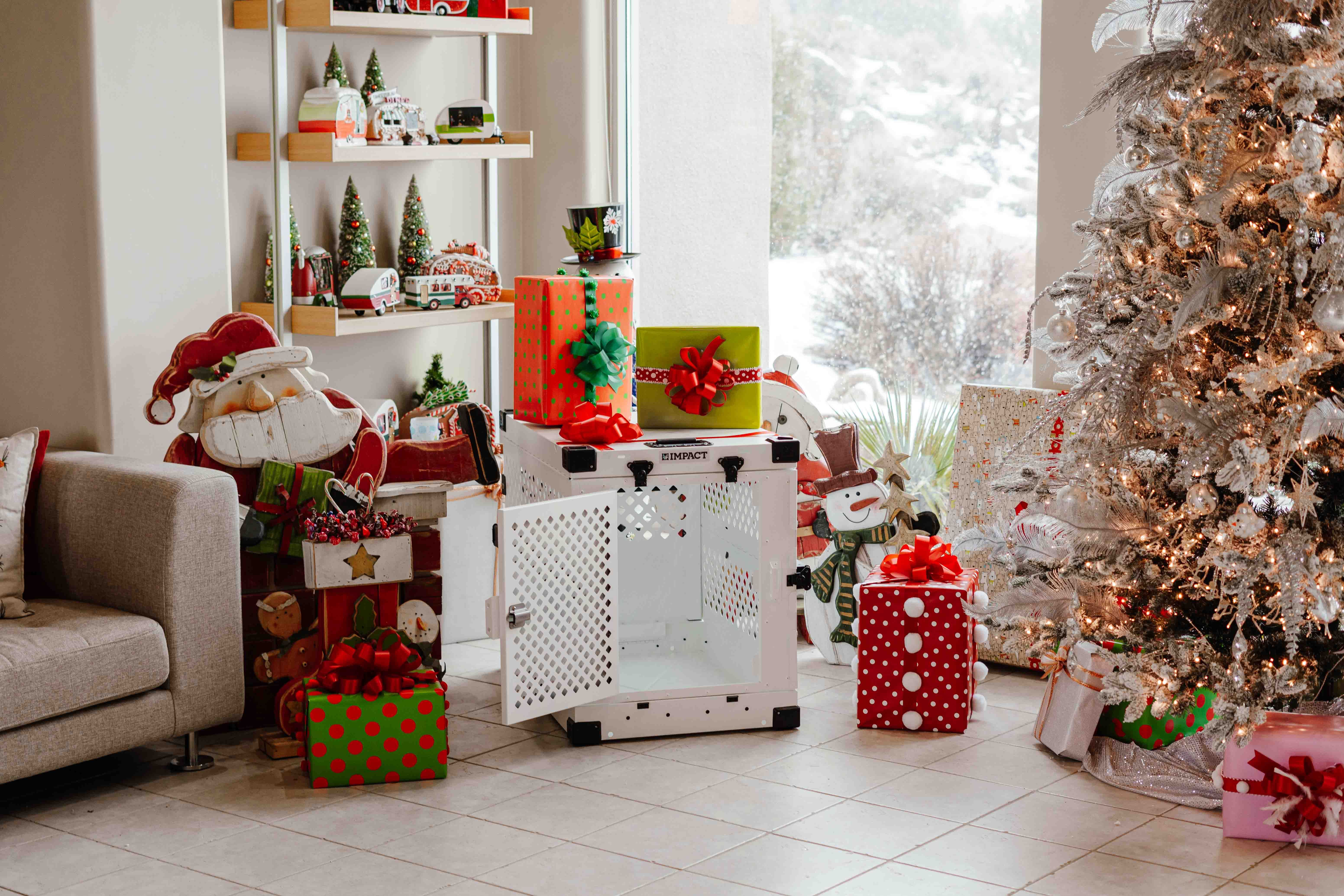 Festive Christmas Living Room with Gifts and Dog Crate · Free Stock Photo