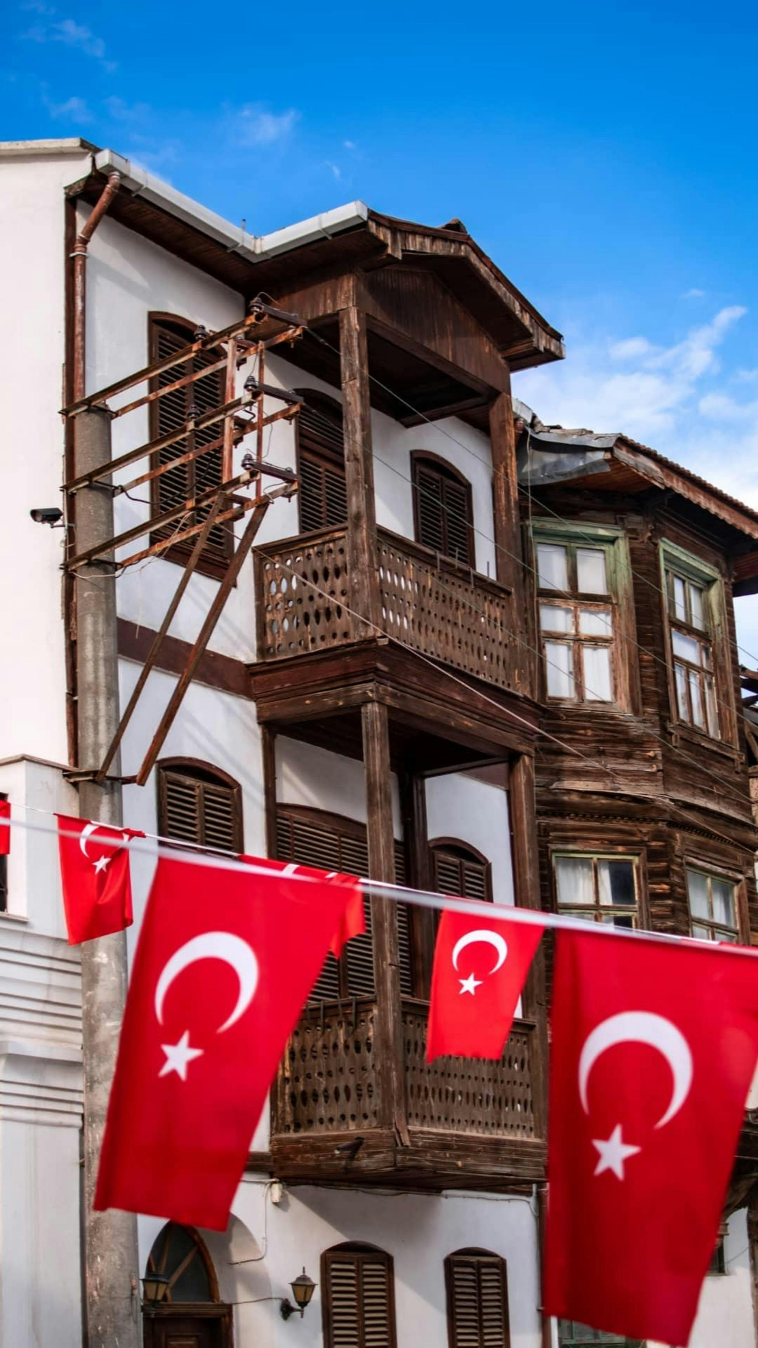 Traditional Turkish Architecture with Flags · Free Stock Photo