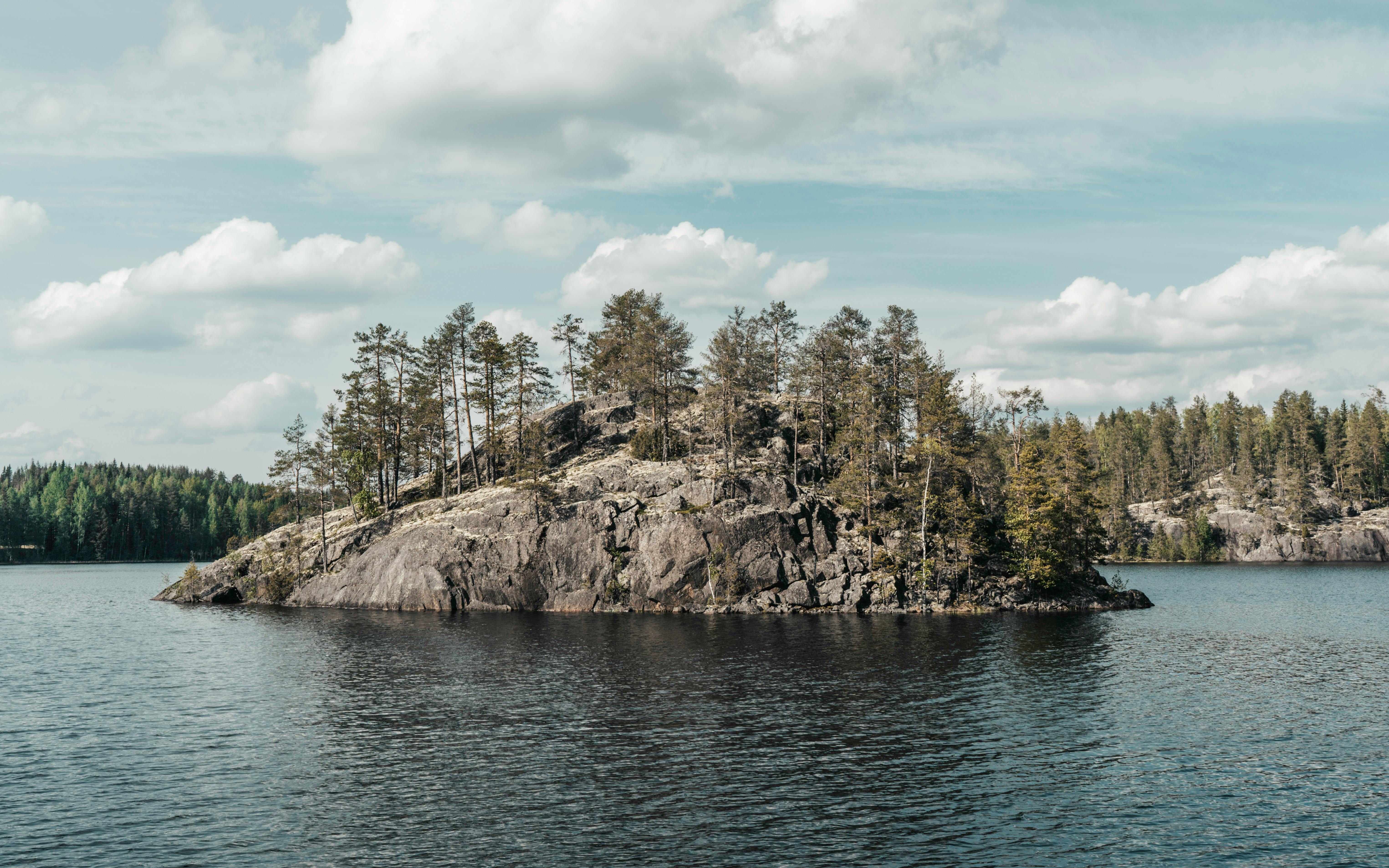 Serene Finnish Island in Tranquil Lake View · Free Stock Photo