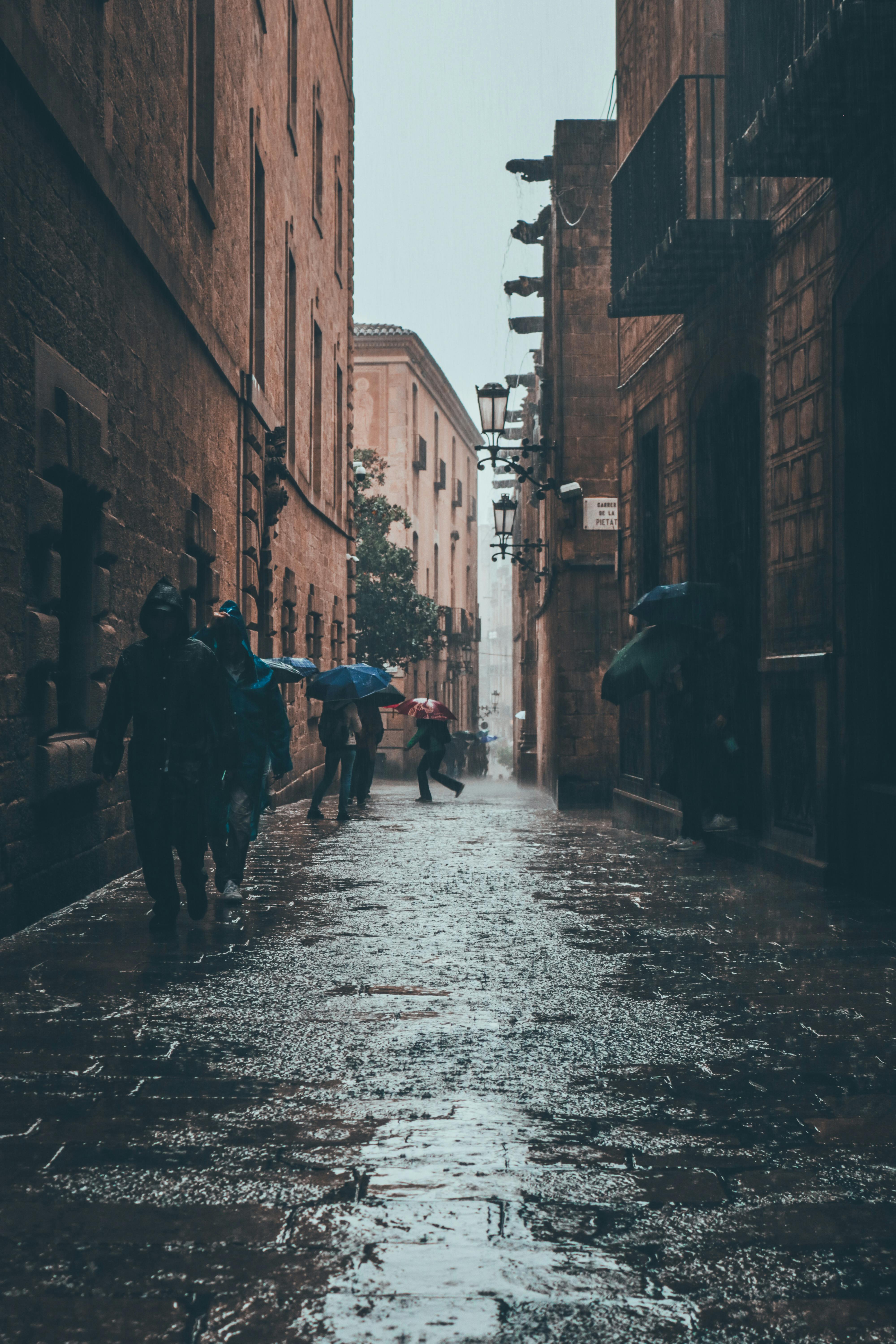 Rain-soaked Street in Gothic Quarter of Barcelona · Free Stock Photo