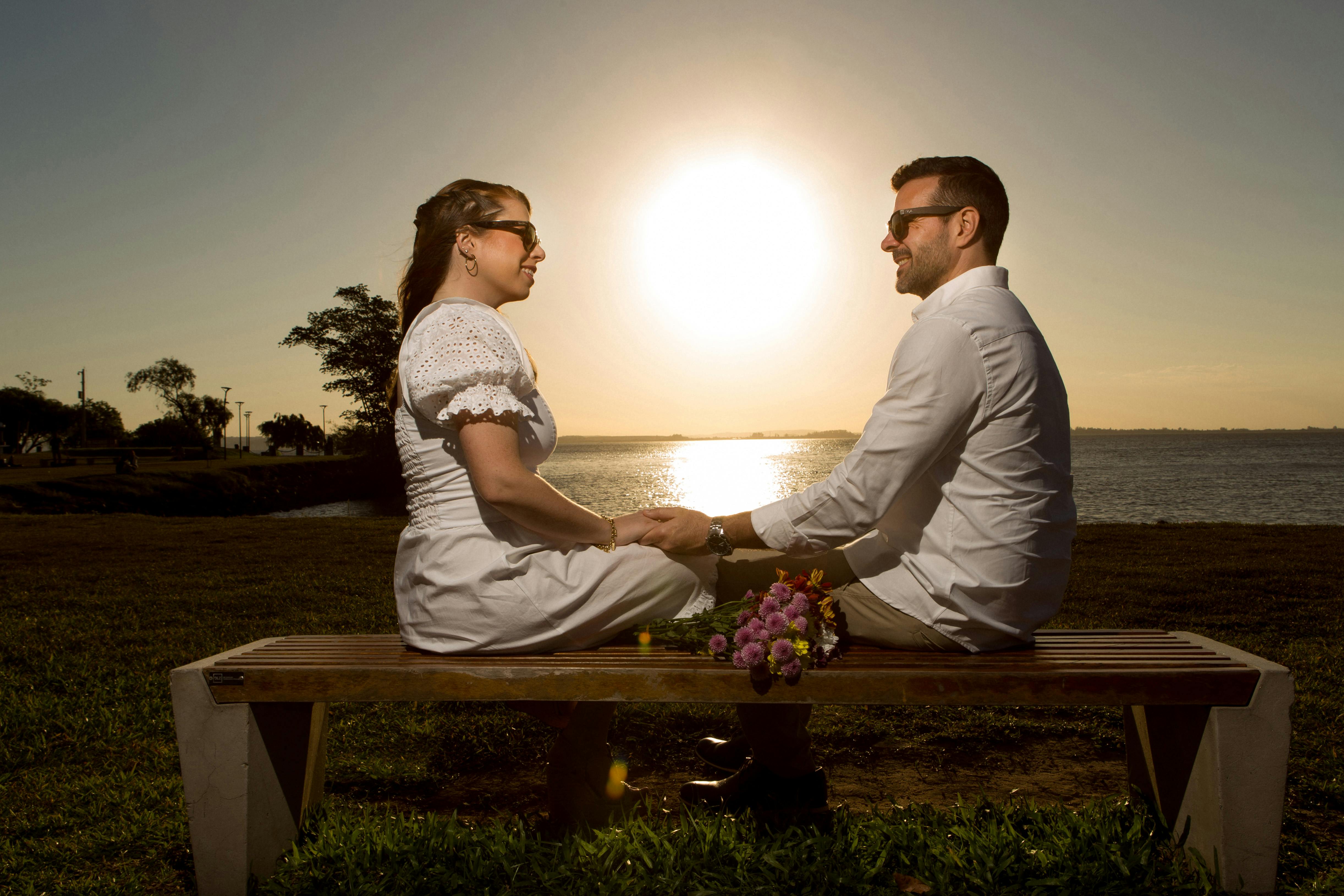 Romantic Couple at Sunset by Lake · Free Stock Photo