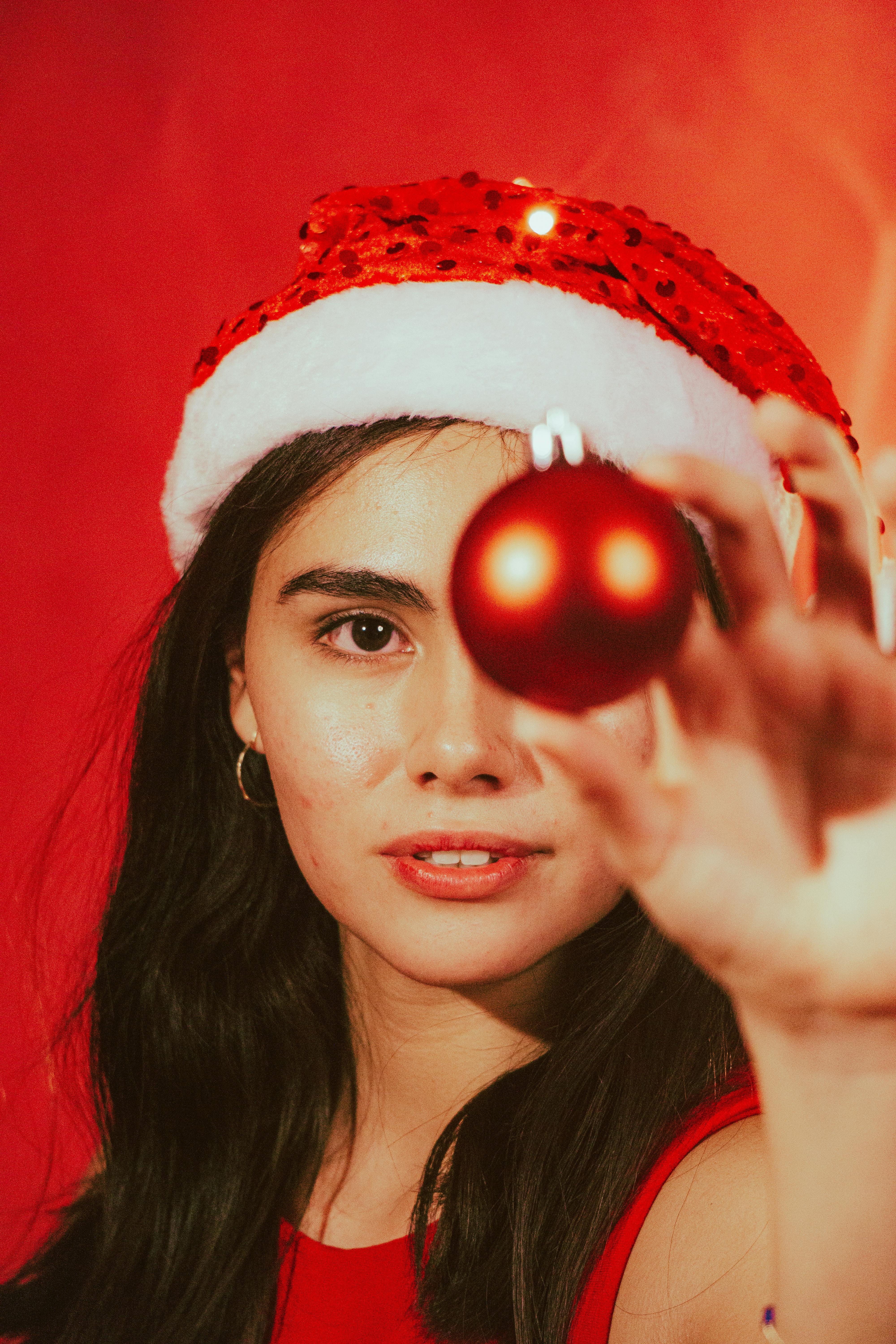 Festive Portrait with Christmas Ornament · Free Stock Photo